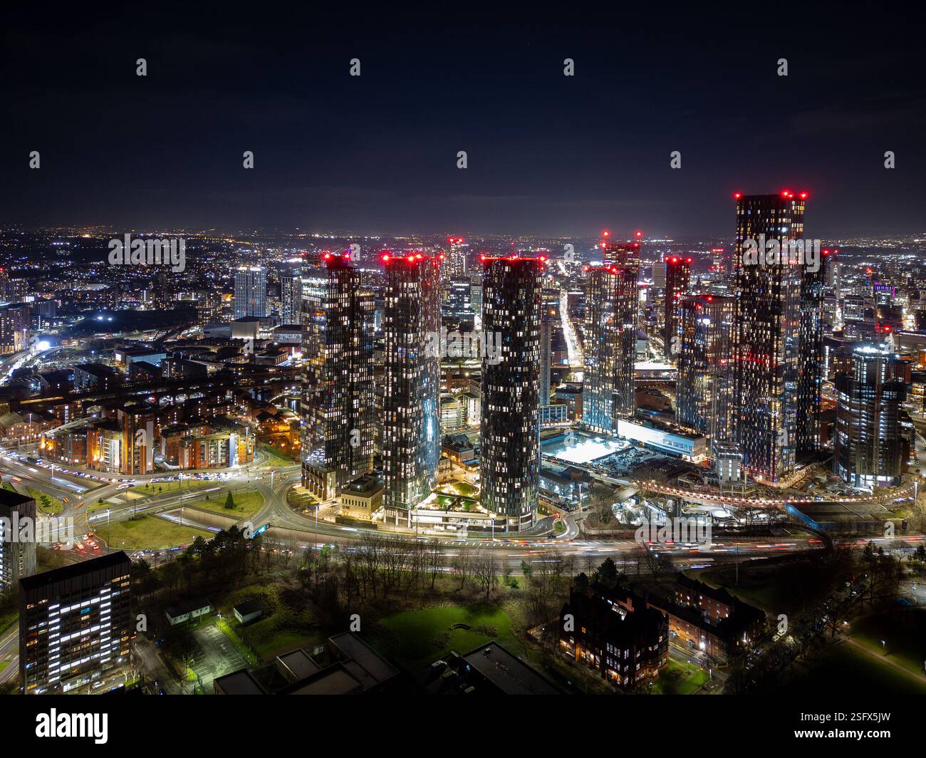 A breathtaking nighttime cityscape view of Manchester's modern skyline ...