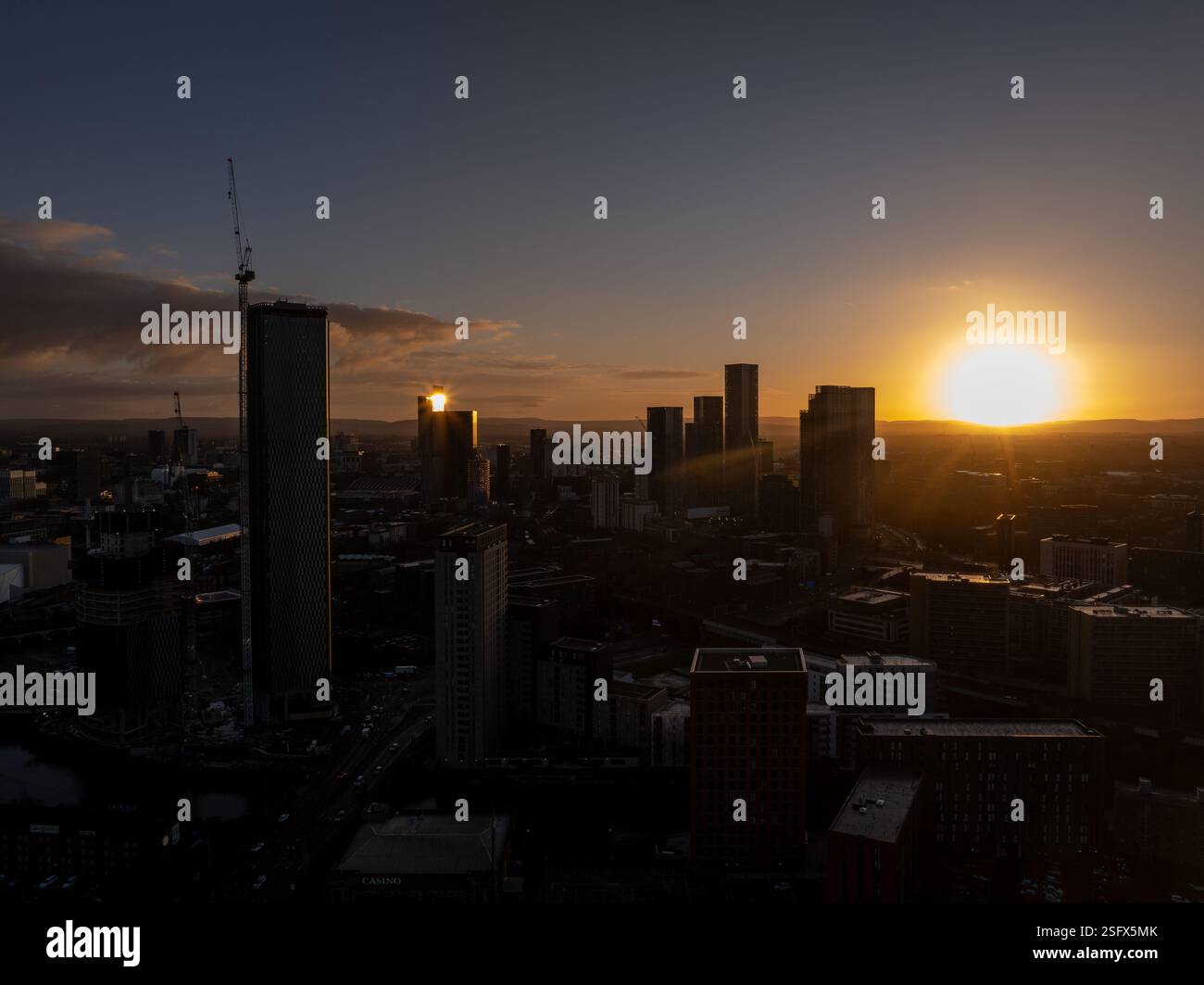 A breathtaking view of Manchester city center during sunset, showcasing ...