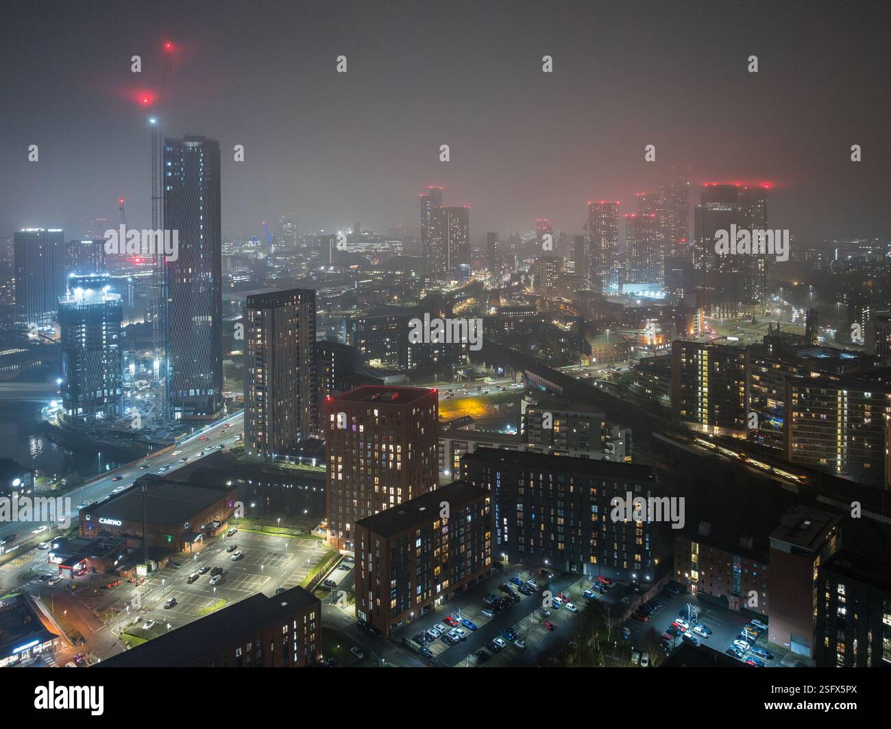 A stunning night view of Manchester city center depicting its modern ...
