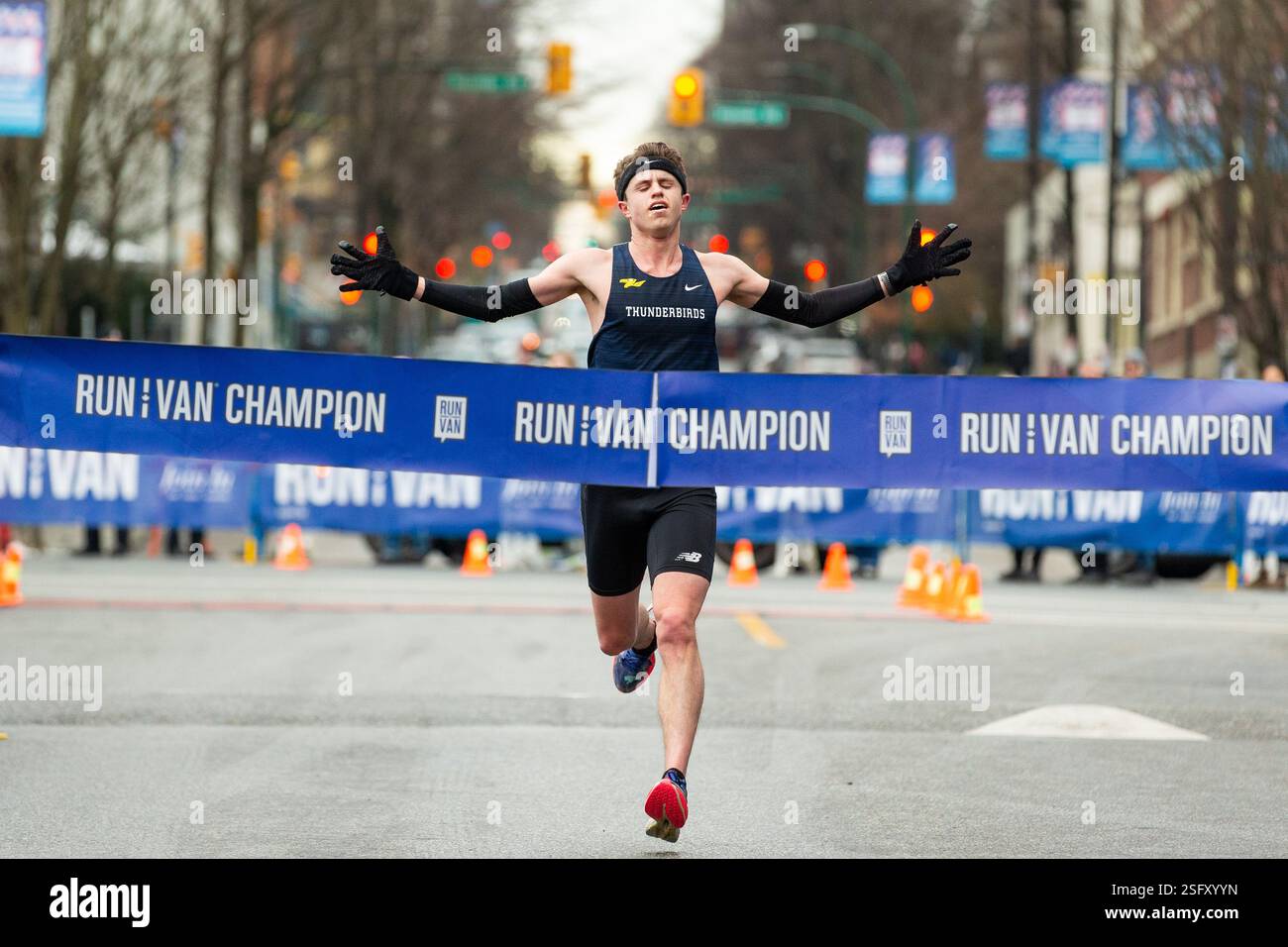 Vancouver, Canada - 9 Feb, 2025. Andrew Davies crossing the finish line ...
