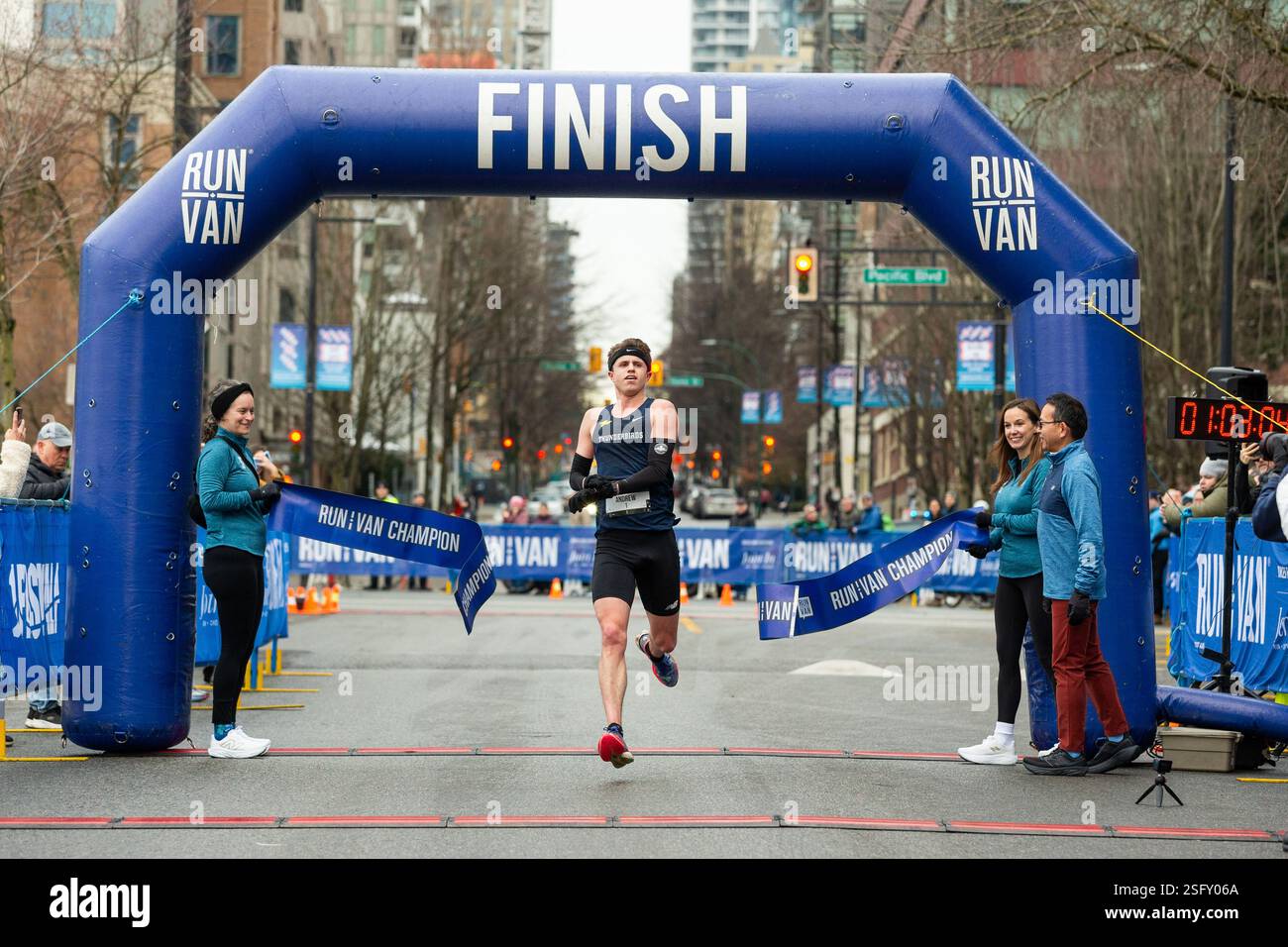 Vancouver, Canada - 9 Feb, 2025. Andrew Davies crossing the finish line ...