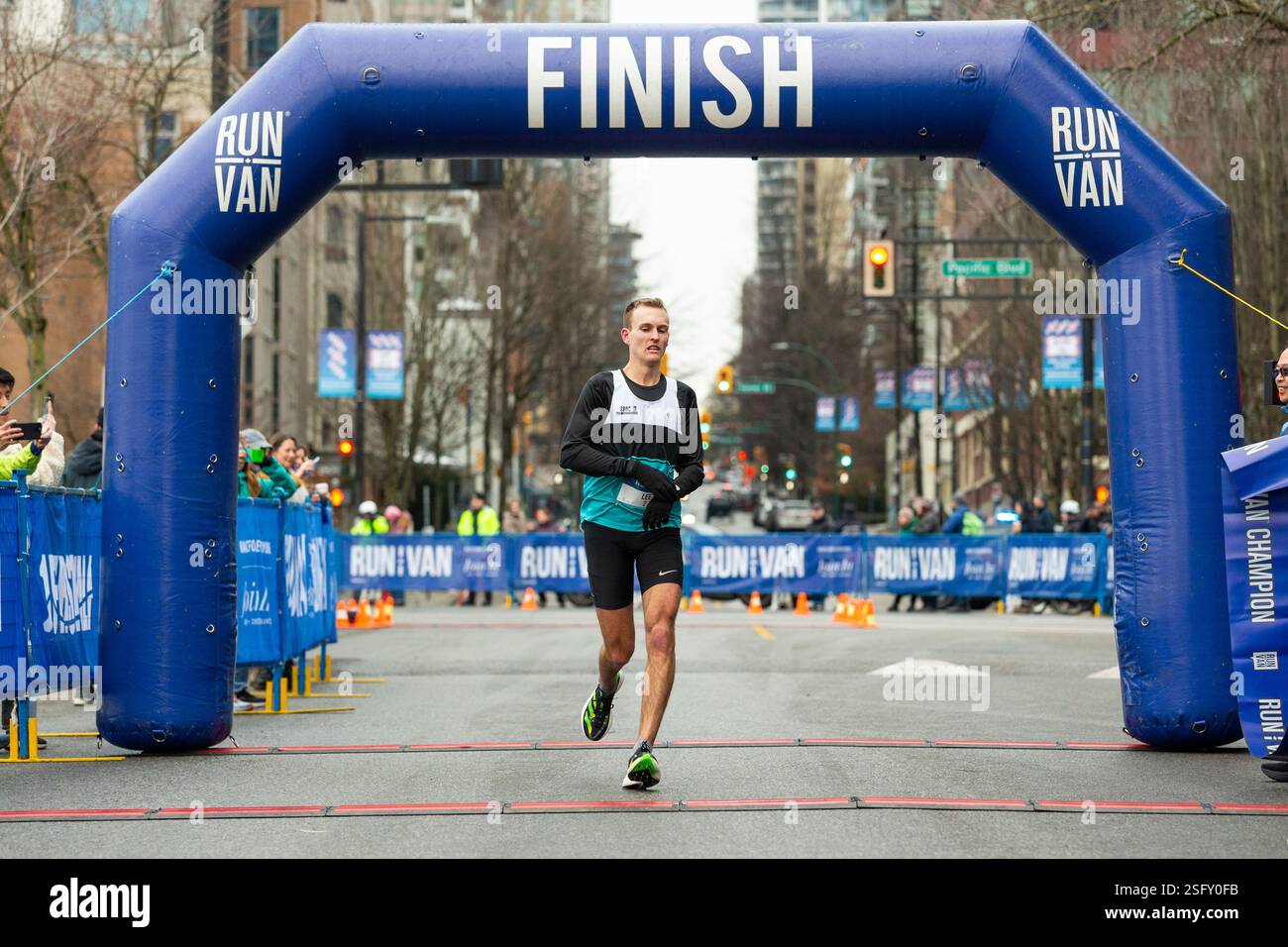 Vancouver, Canada - 9 Feb, 2025. Lee Wesselius crossing the finish line for second place at the ...
