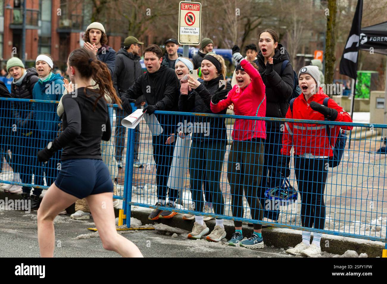 Vancouver, Canada - 9 Feb, 2025. Supports cheering runners during the ...