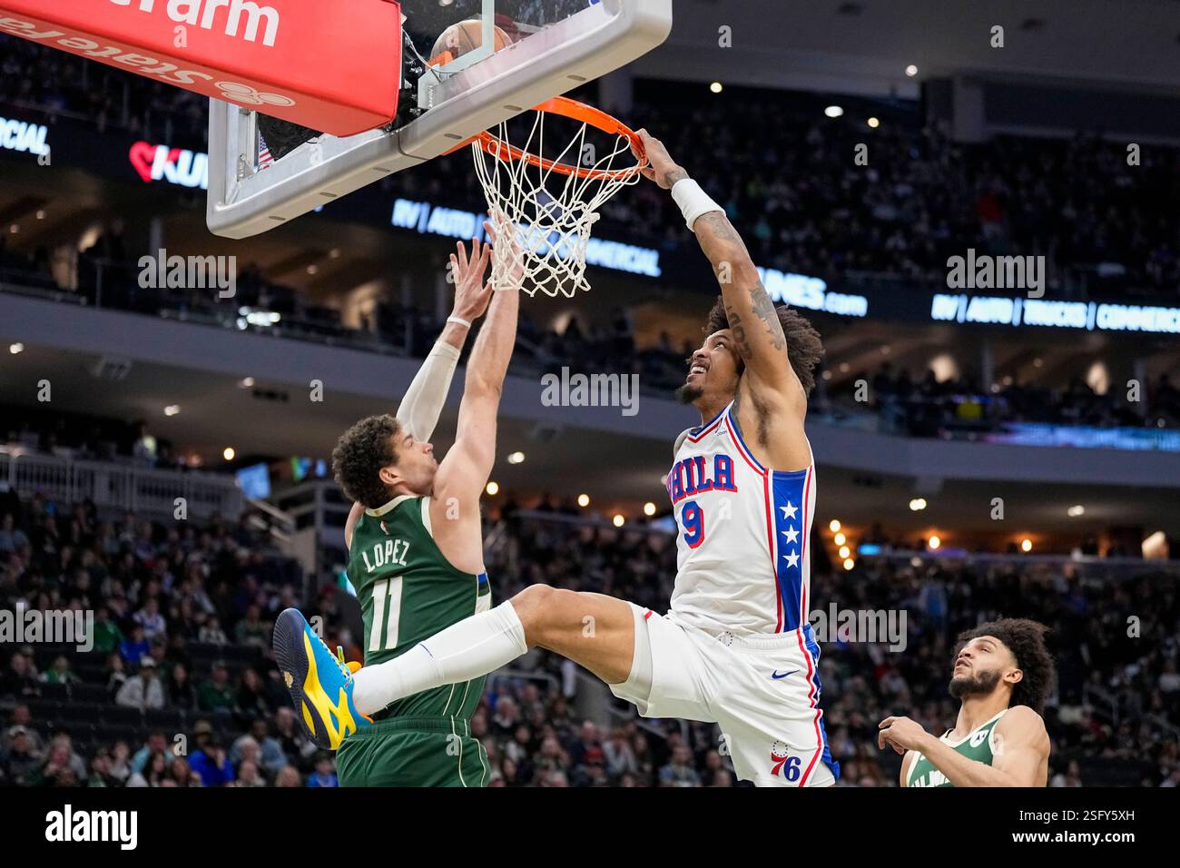 Philadelphia 76ers' Kelly Oubre Jr. (9) misses a slam dunk against Milwaukee Bucks' Brook Lopez ...
