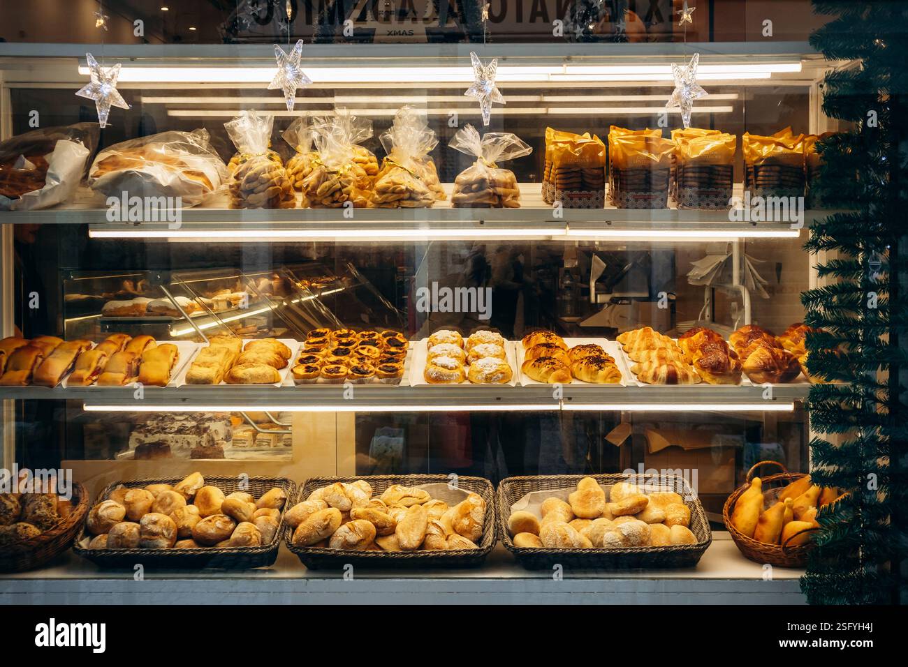 Traditional pastries and desserts in a bakery in the center of Porto ...