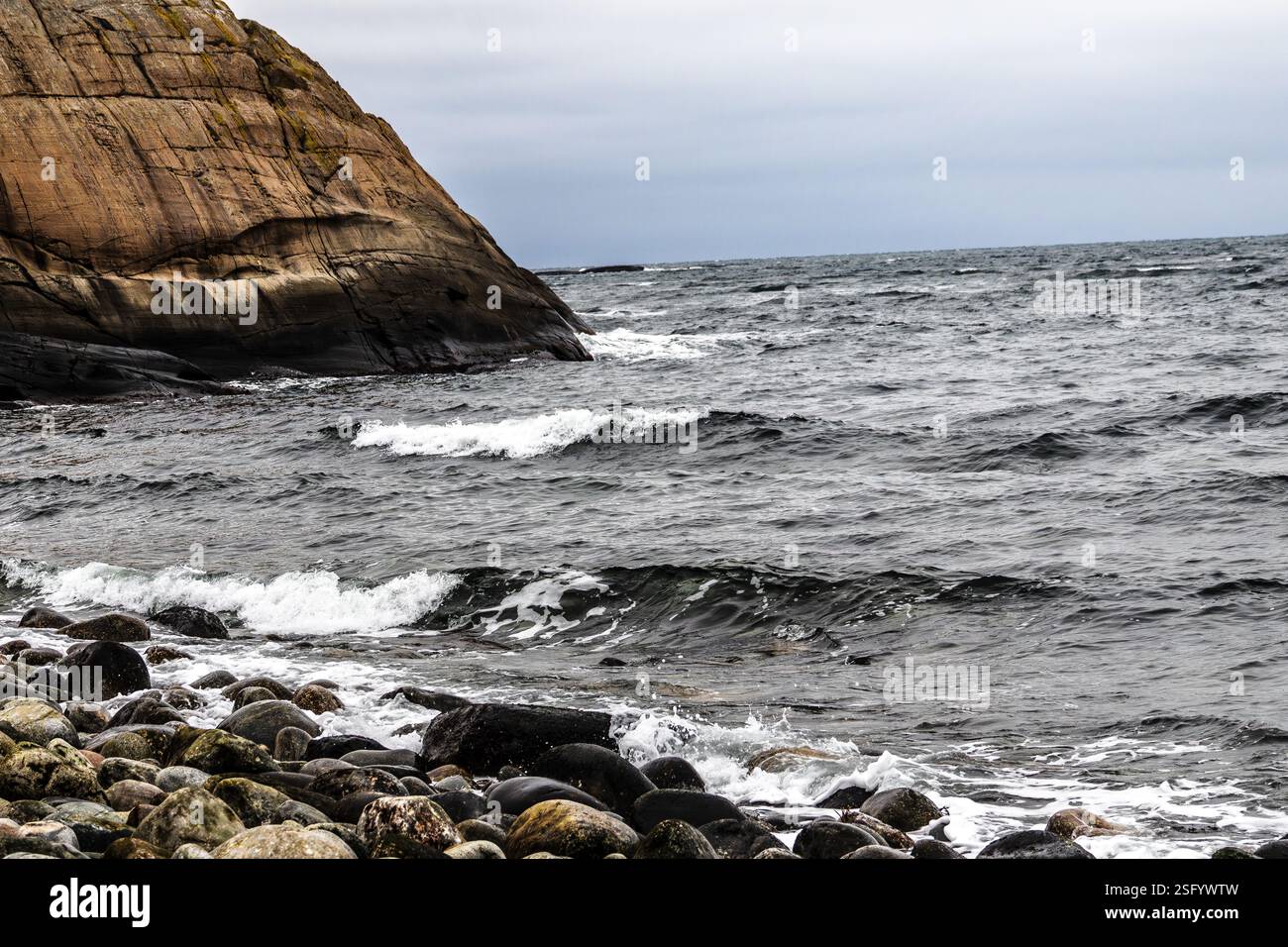 Dramatic waves crash along shoreline hi-res stock photography and ...