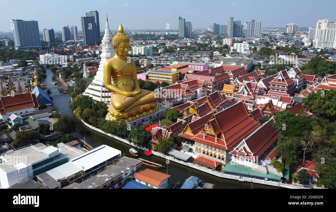 Aerial view of a big Buddha golden statue at Wat Paknam Phasi Charoen temple in Bangkok ...