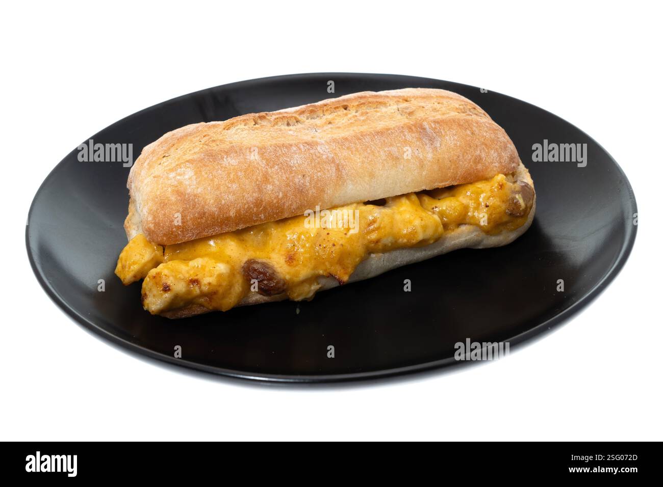 Curried Coronation Chicken bread sandwich on a plate - white background ...