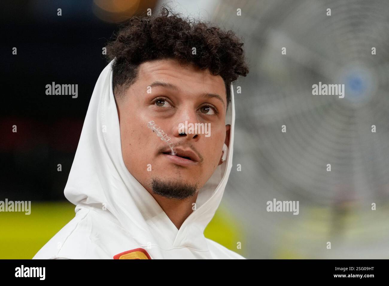Kansas City Chiefs quarterback Patrick Mahomes sits in the bench area ...