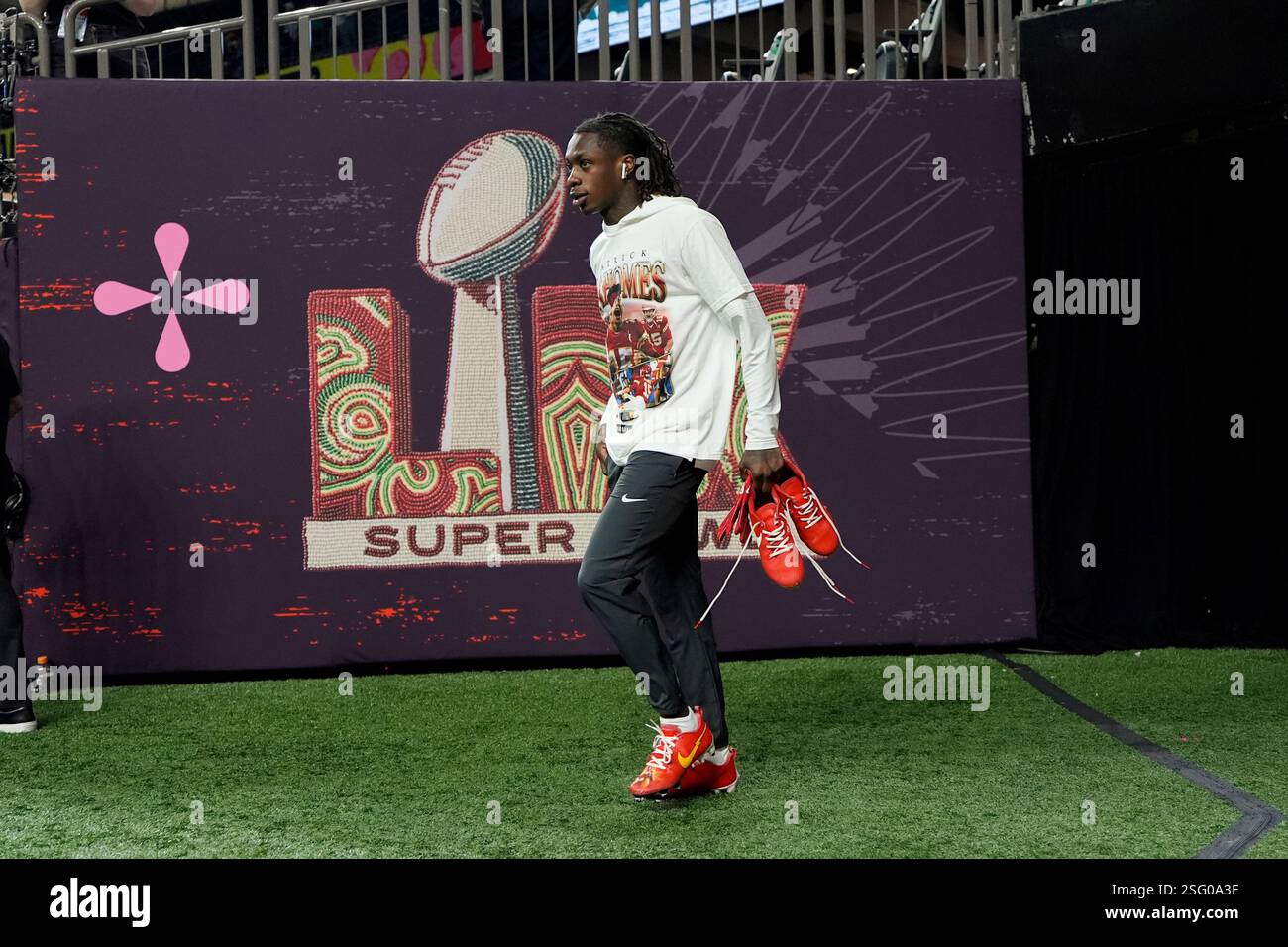 Kansas City Chiefs wide receiver Xavier Worthy walks to the field to ...