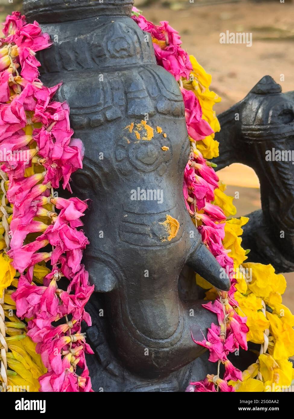 Stone Ganesh statue with puja on the grounds of the Sarayana Ayurvedic ...