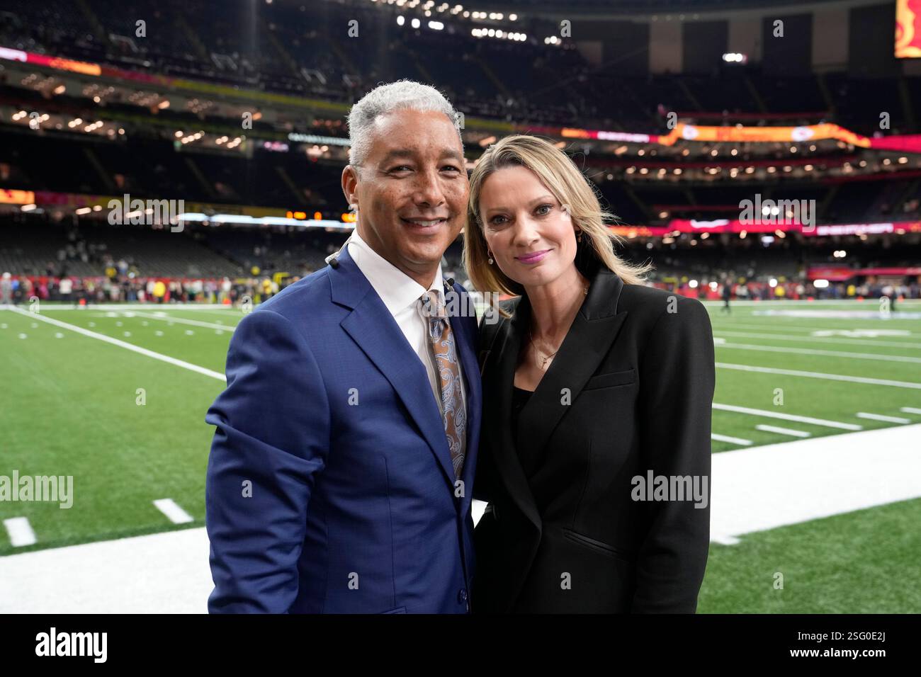 NFL Network reports Steve Wyche, left, and Stacey Dales pose for a ...