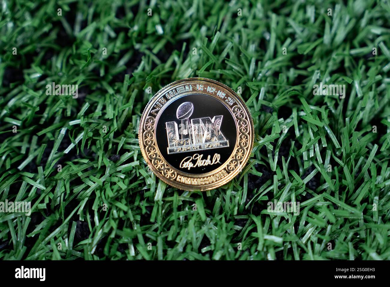 The official Super Bowl coin sits on the field before the NFL Super ...
