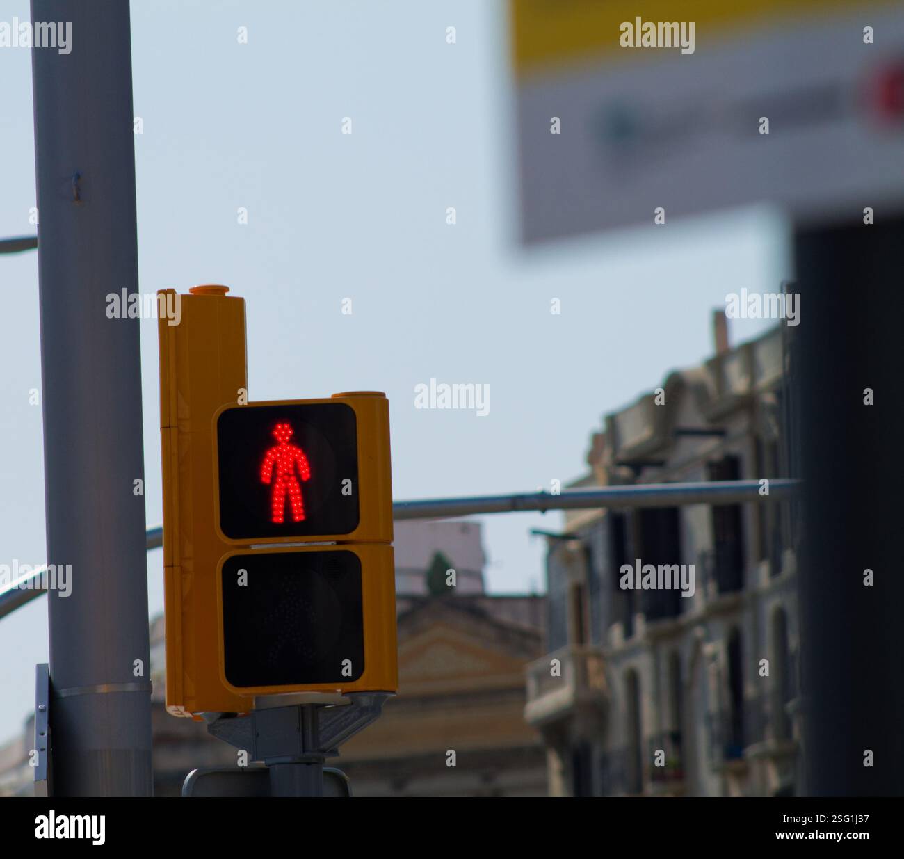 A red pedestrian traffic light symbolizing 'stop' for pedestrians. The ...