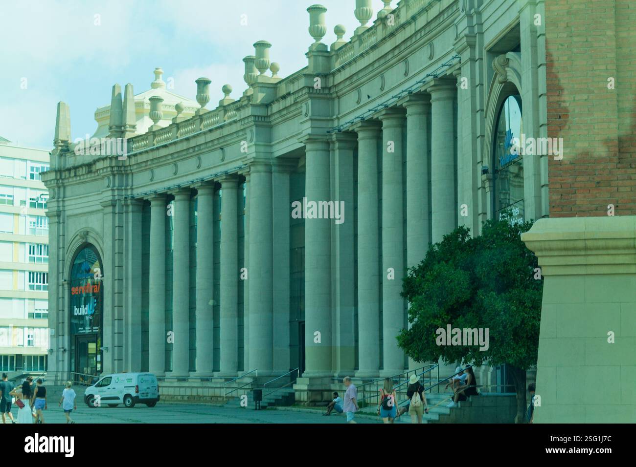 A grand architectural structure featuring tall columns and a large ...