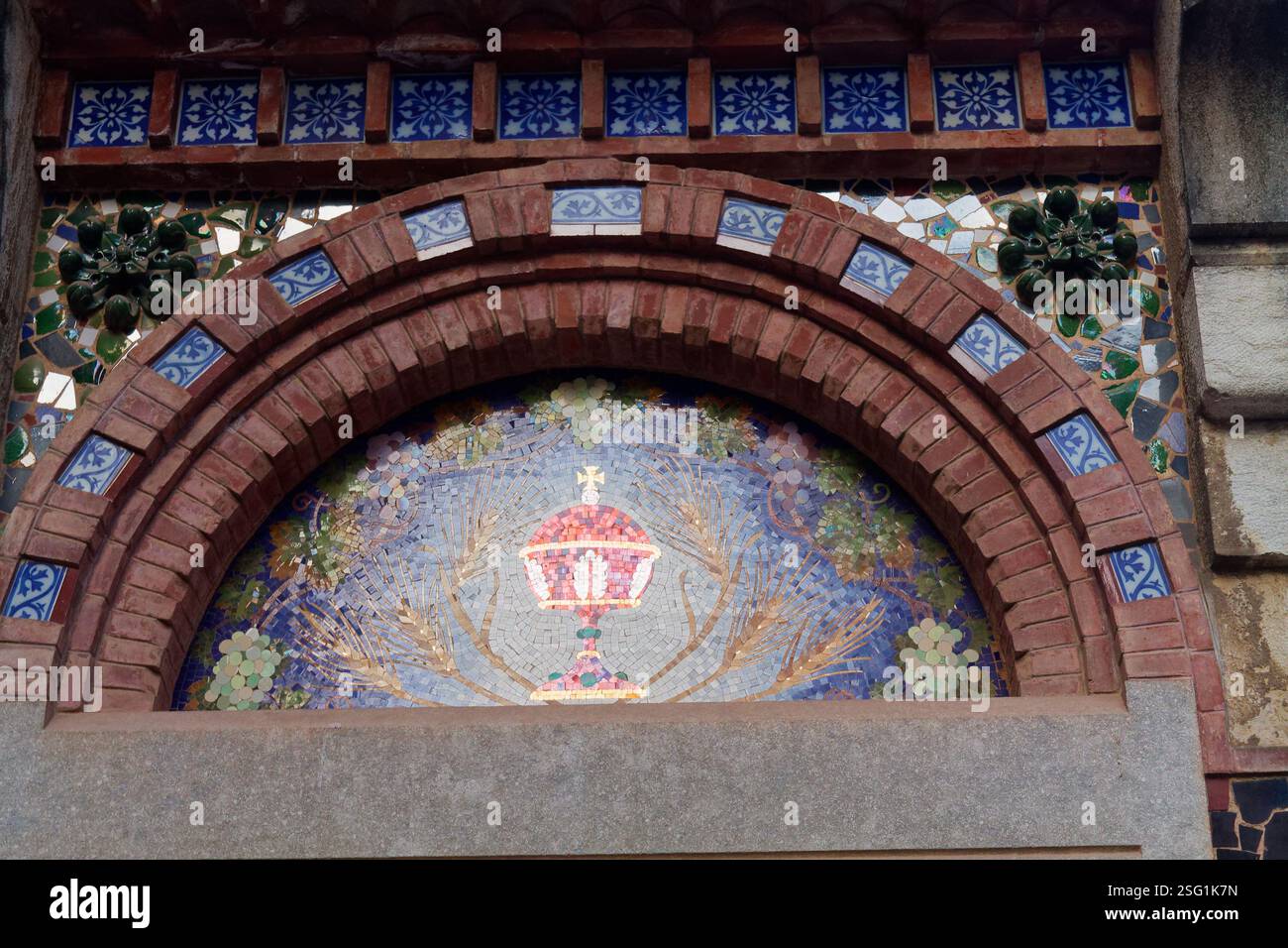 A decorative archway featuring intricate mosaic tiles in various colors ...