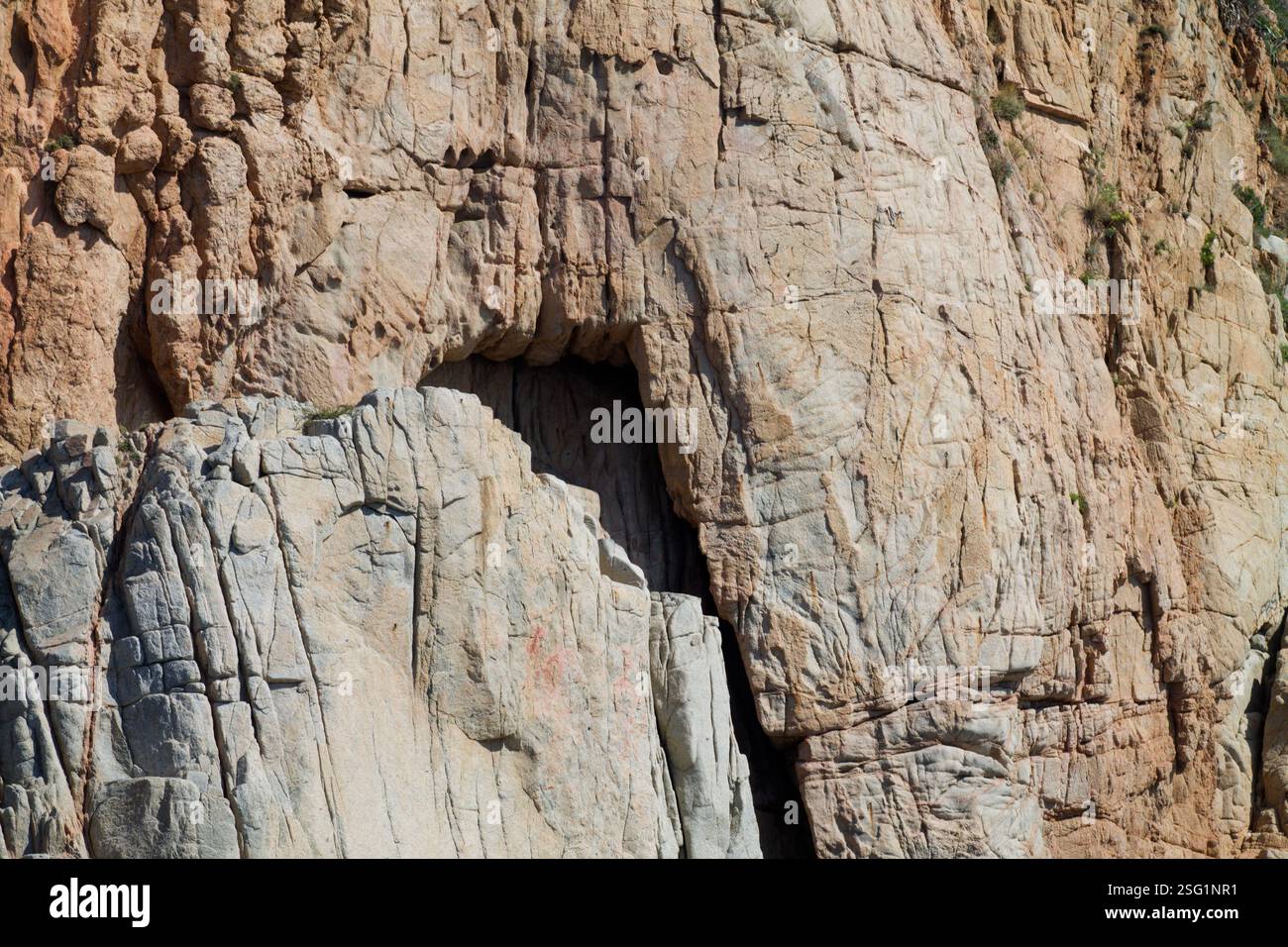 A close-up view of a rocky cliff face showcasing various textures and ...