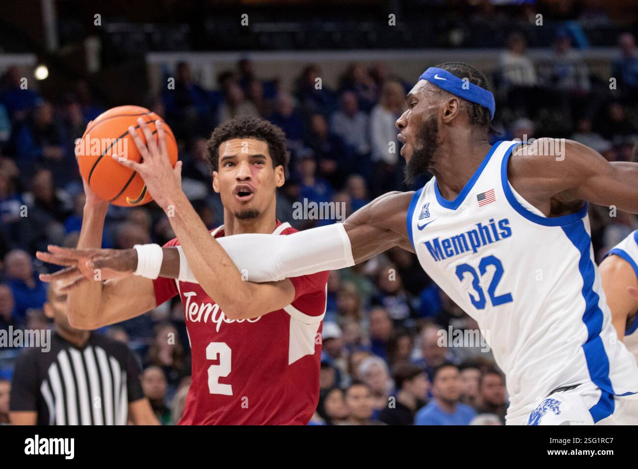 Temple forward Steve Settle III (2) handles the ball while defended by ...