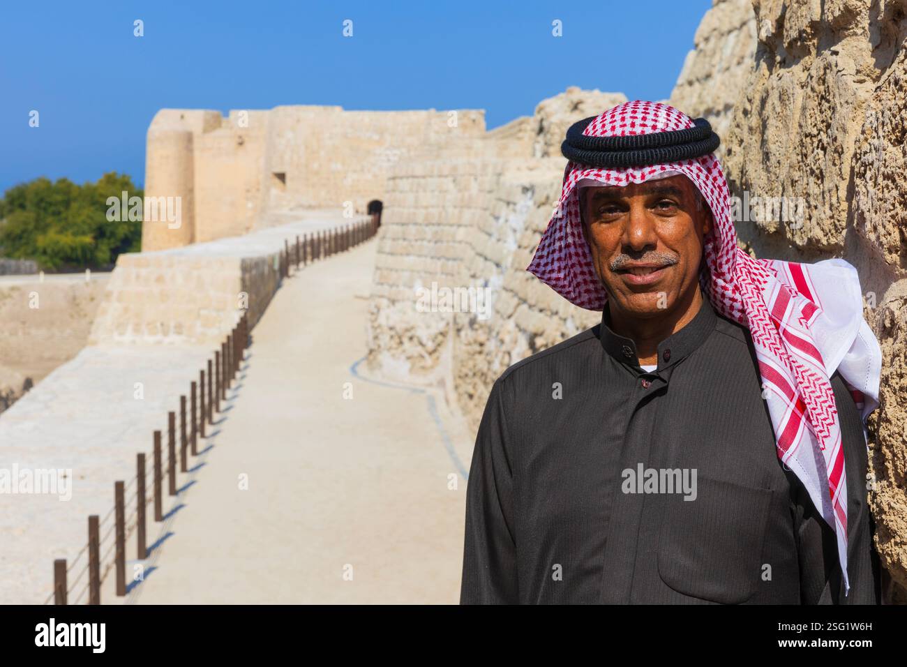 Bahraini man in traditional attire at Qal'at al-Bahrain also known as ...