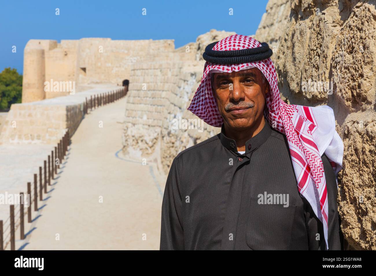 Bahraini man in traditional attire at Qal'at al-Bahrain also known as ...