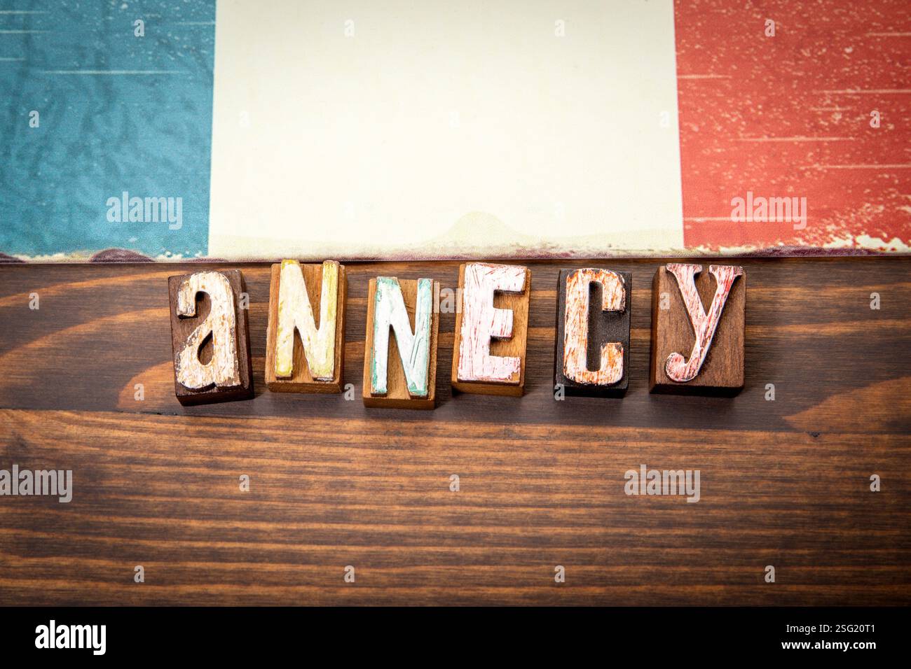 ANNECY. Flag and alphabet letters on wooden texture background Stock ...