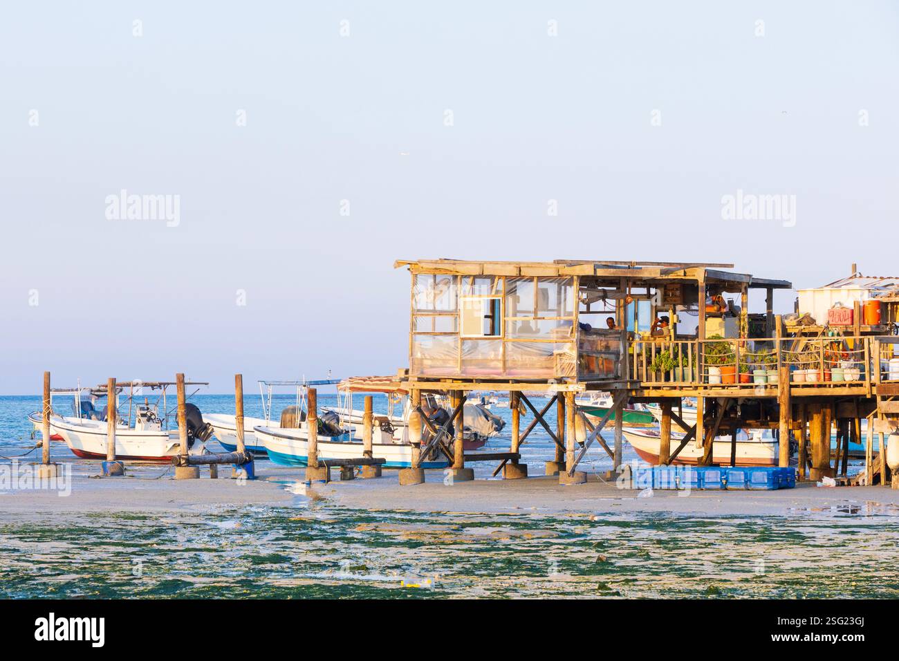Bahraini people enjoying some drinks at a traditional restaurant at ...