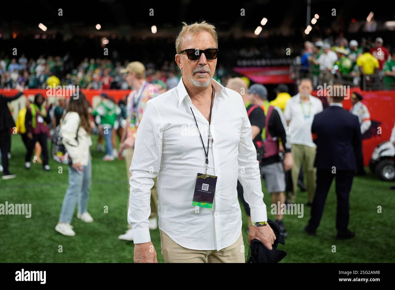 Kevin Costner stands on the field before the NFL Super Bowl 59 football ...