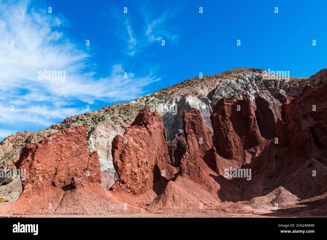 Red rocks and green hills in the arcoiris valley Stock Photo - Alamy