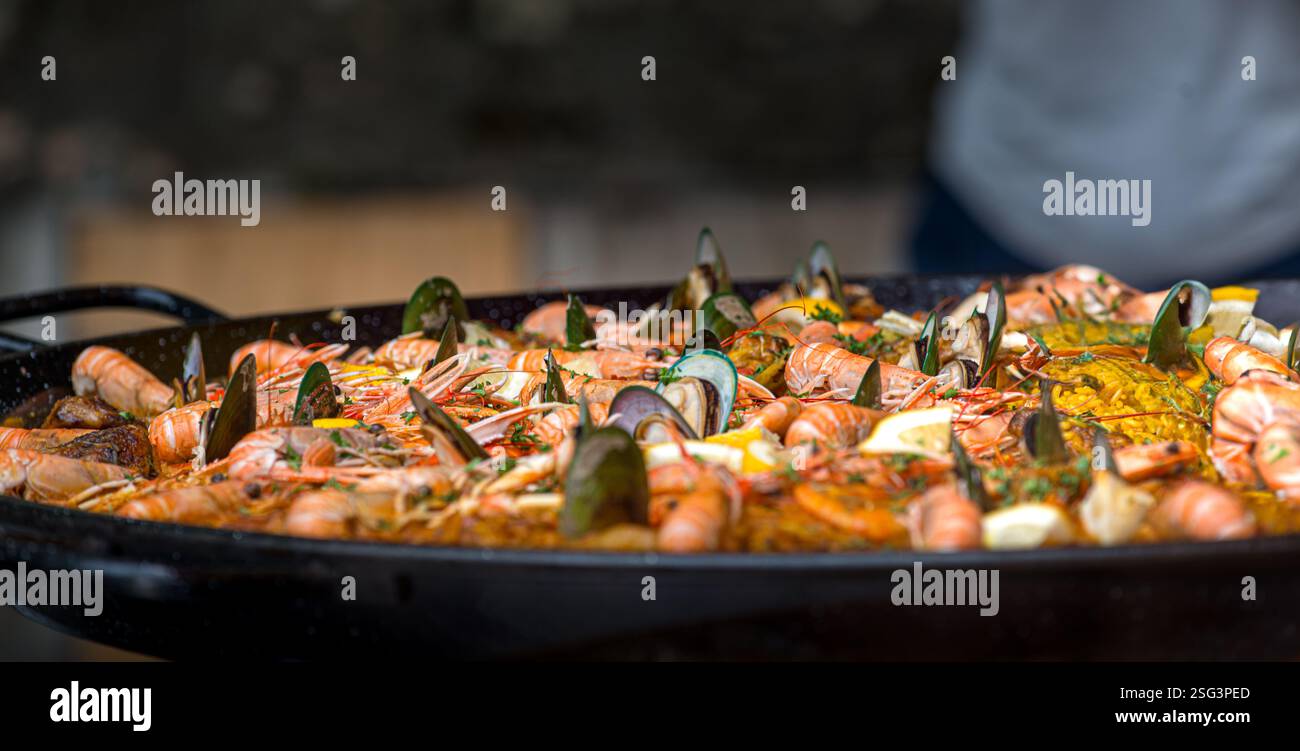 Delicious paella served with fresh seafood and vibrant colors at a ...