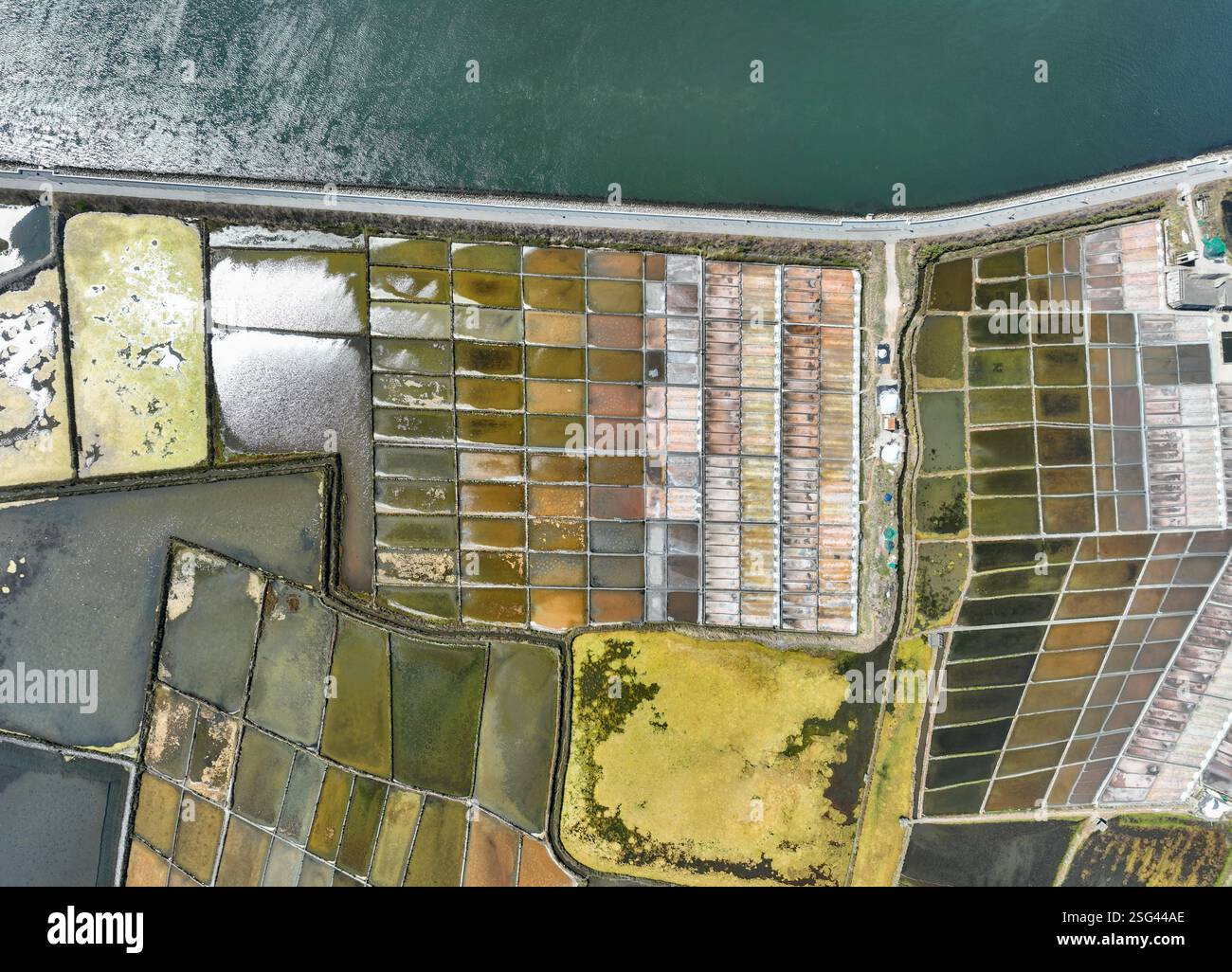 Traditional salt extraction camp (Salinas) with piles of extracted salt ...