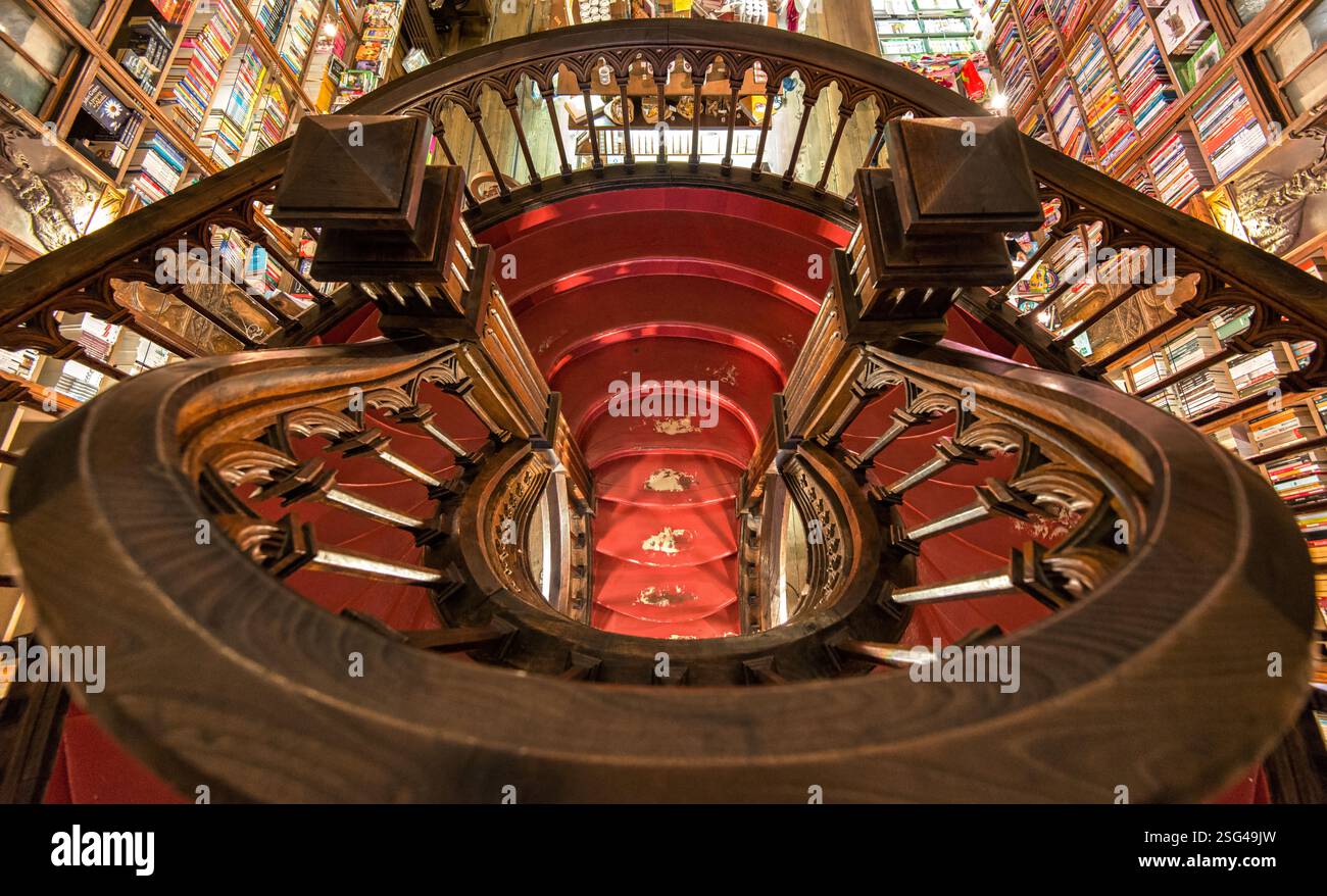 Stunning spiral staircase in a historic library with vast bookshelves ...