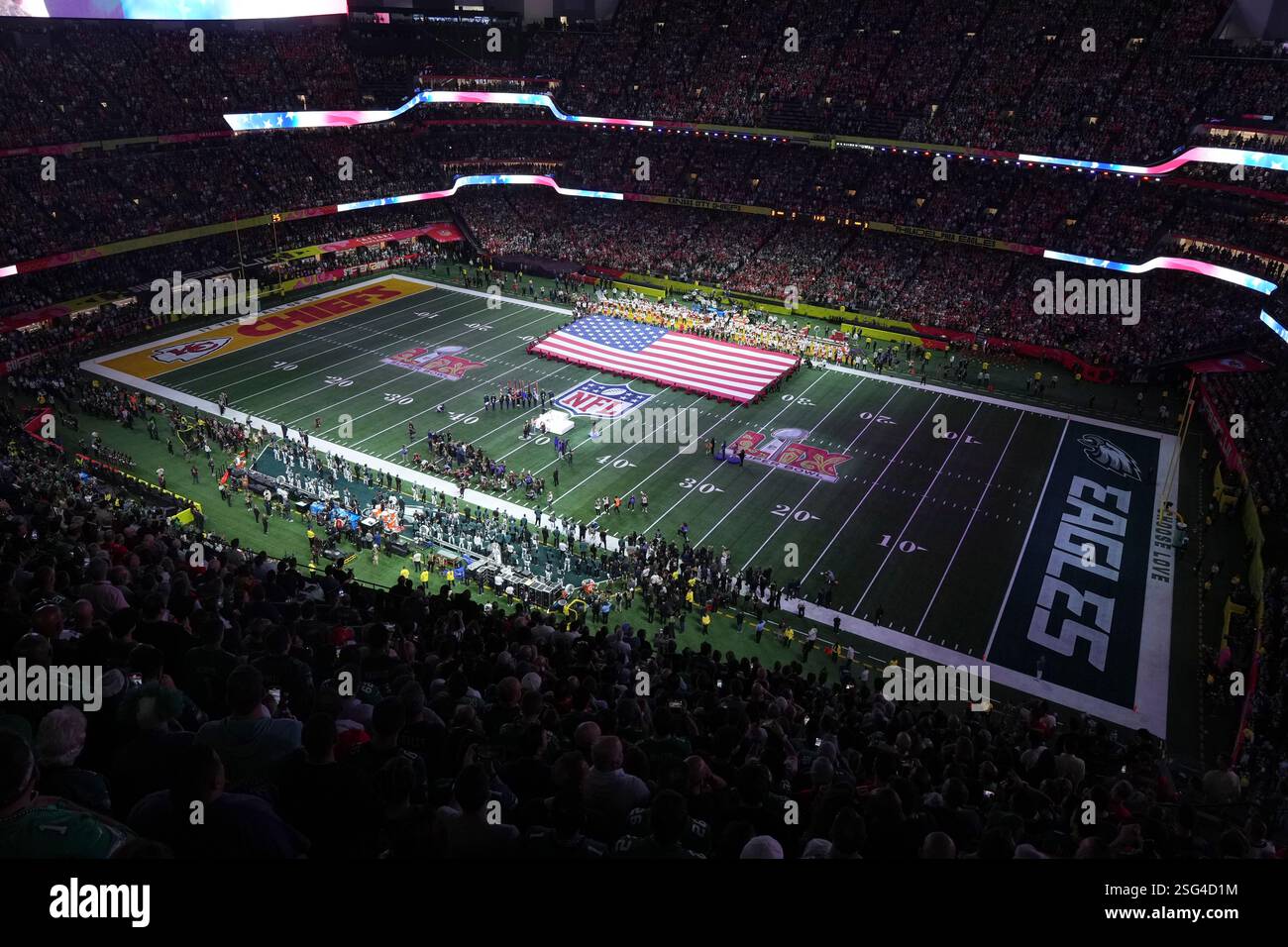 The US flag is displayed on the field during the singing of the ...