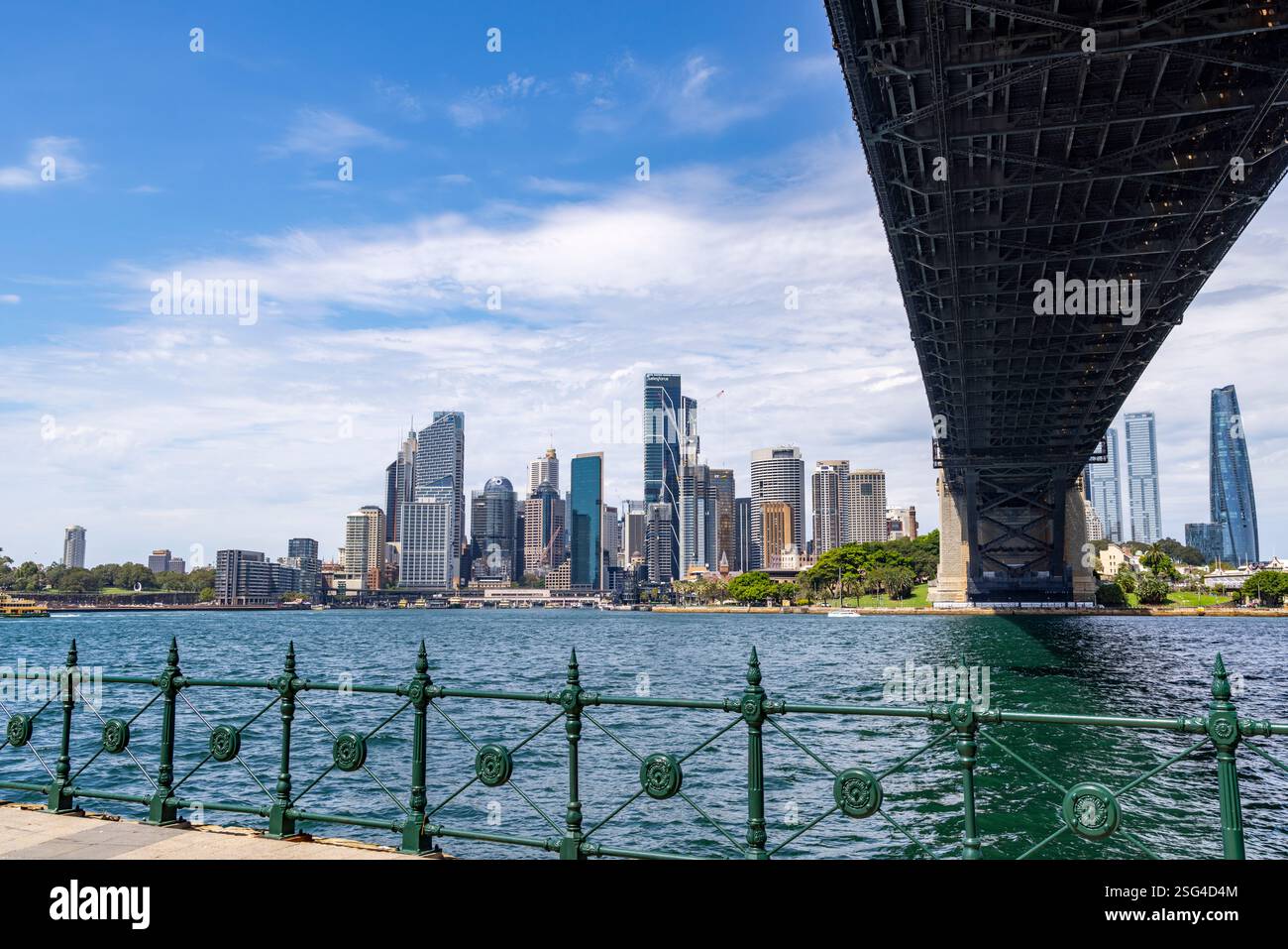 Sydney harbour bridge with views across the harbour to Sydney skyline ...