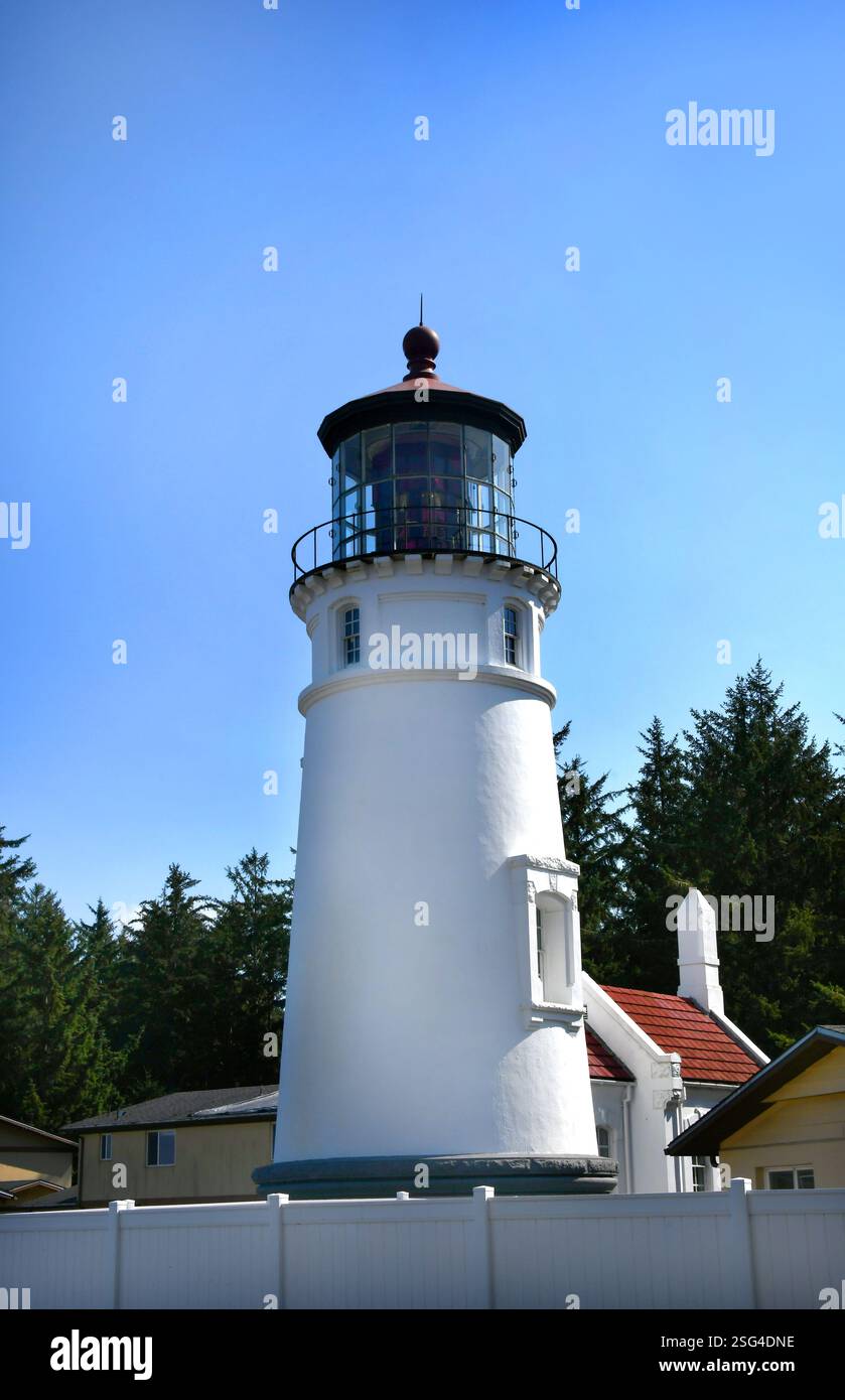 The Umpqua Lighthouse, in Oregon, is cylinder shaped with a red roof ...