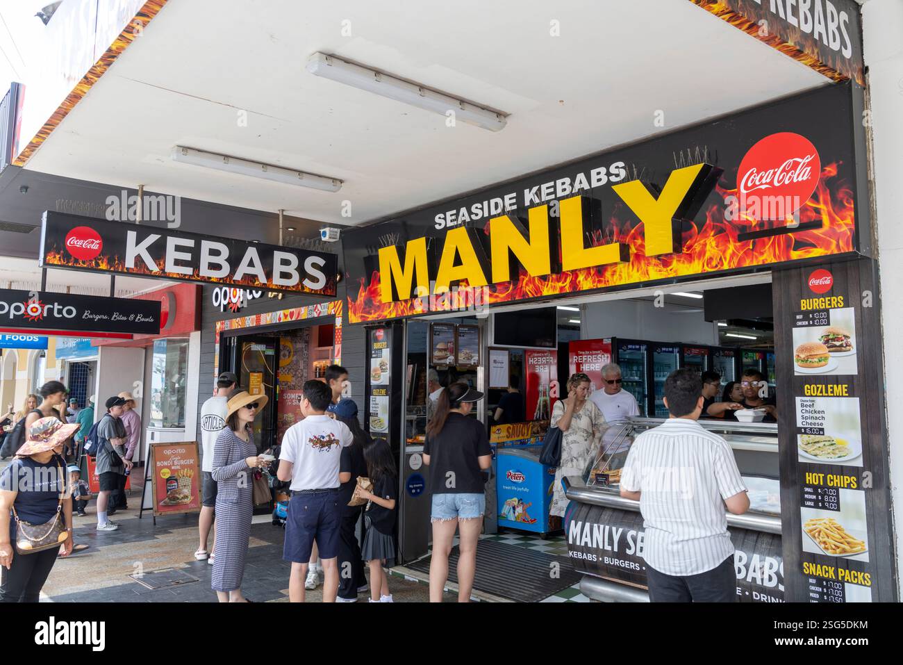 Seaside kebabs fast food takeaway shop with people ordering hot kebabs ...
