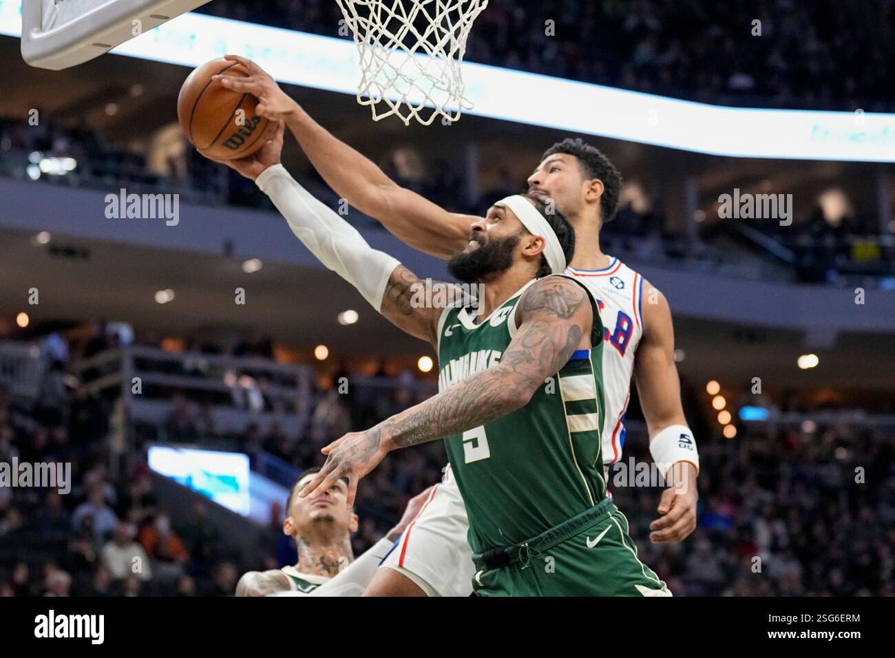 Milwaukee Bucks' Gary Trent Jr., left, and Philadelphia 76ers' Quentin ...