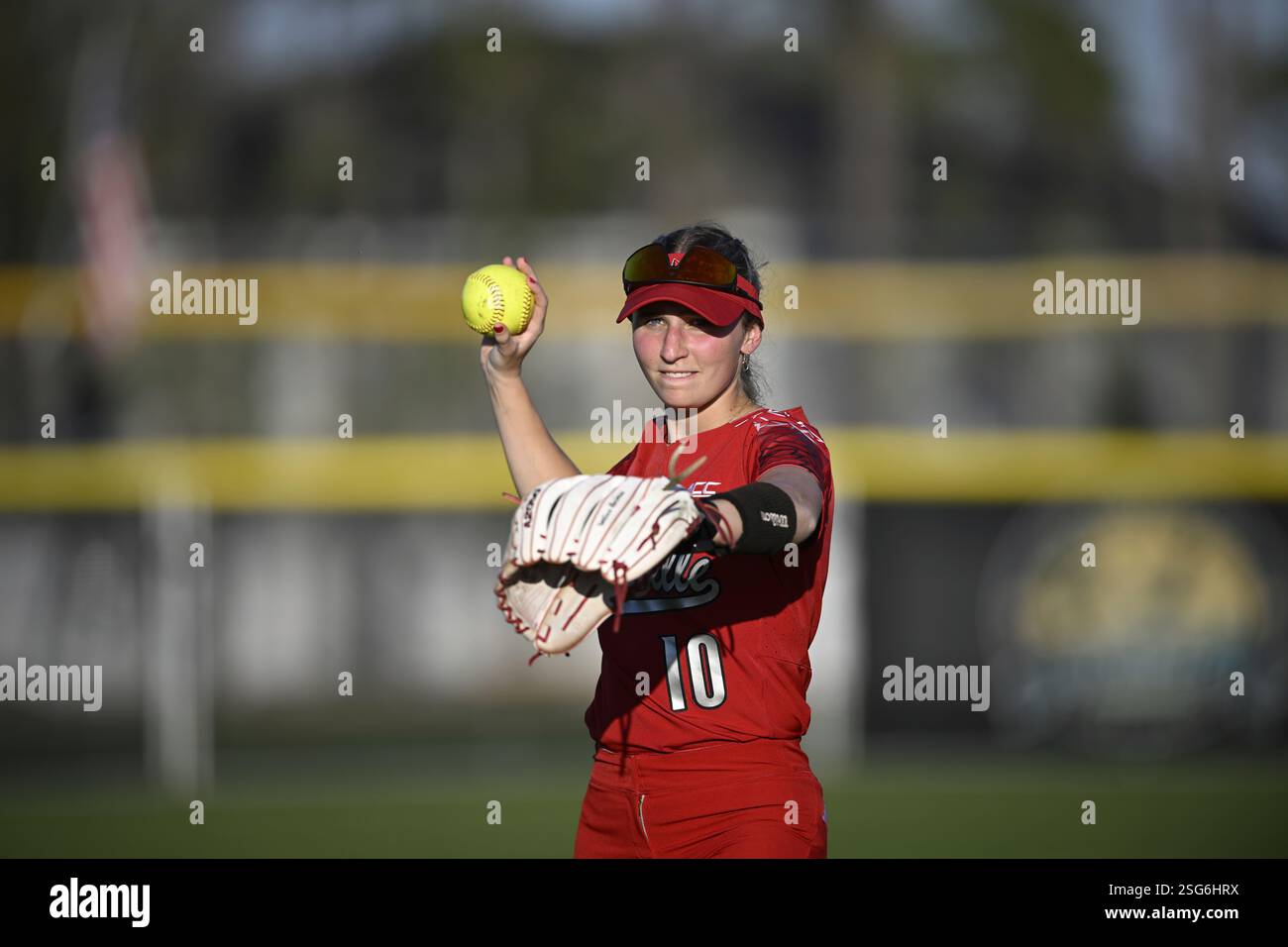 Louisville infielder Chelsea Mack (10) throws during an NCAA college ...