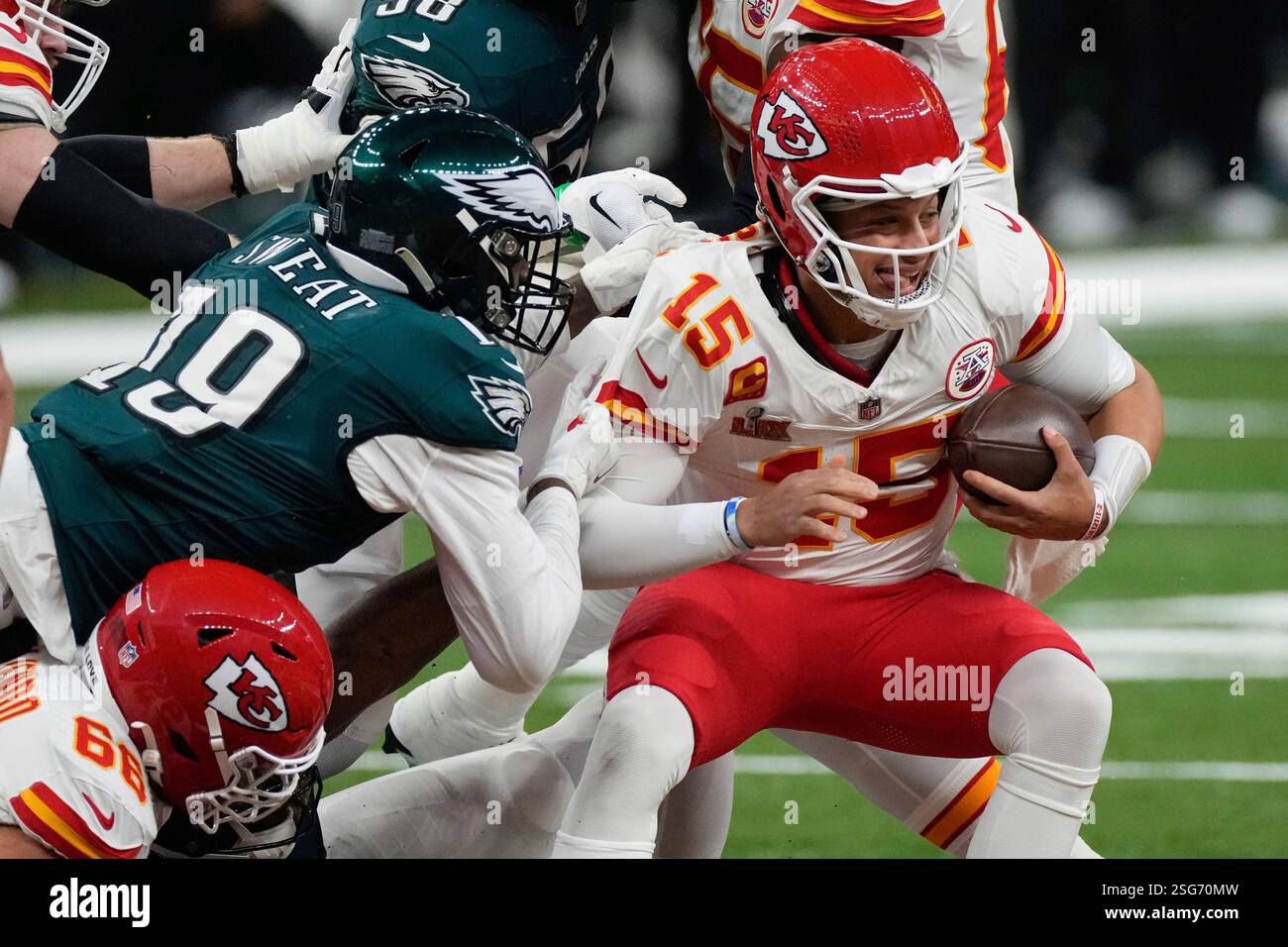 Kansas City Chiefs quarterback Patrick Mahomes (15) is sacked by ...