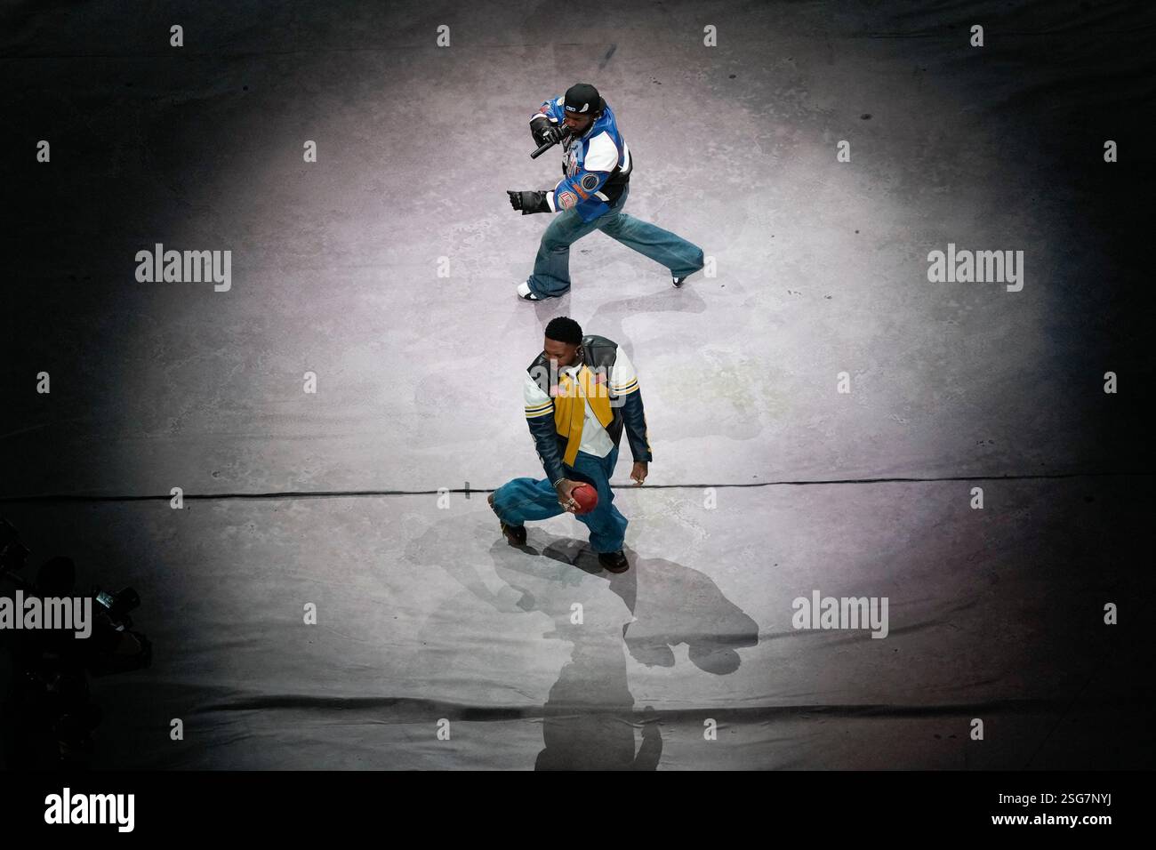 Mustard, bottom, and Kendrick Lamar perform during halftime of the NFL ...