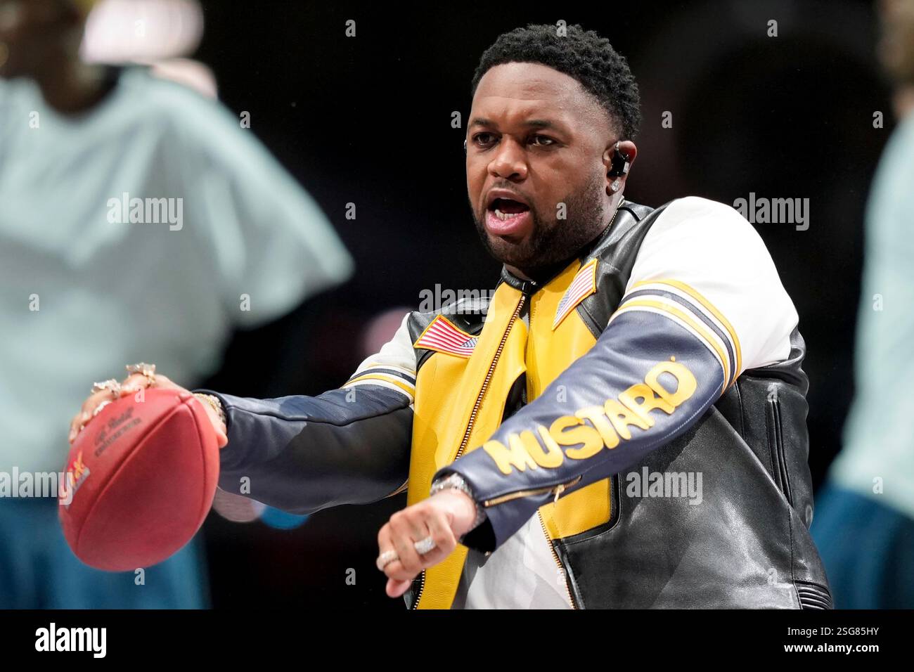 Mustard performs during halftime of the NFL Super Bowl 59 football game ...