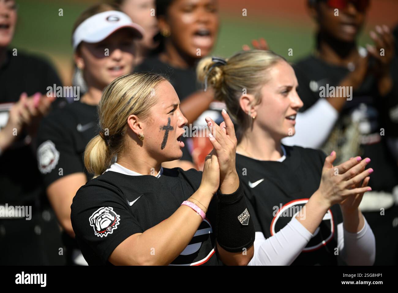 Georgia's Jaydyn Goodwin, front left, reacts after a win against James ...