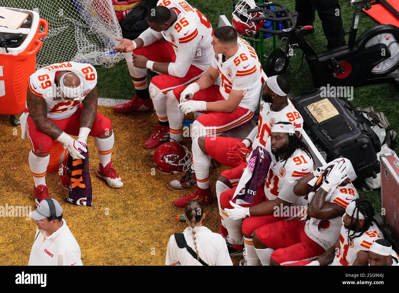 Kansas City Chiefs defensive players sit on the bench during the second ...