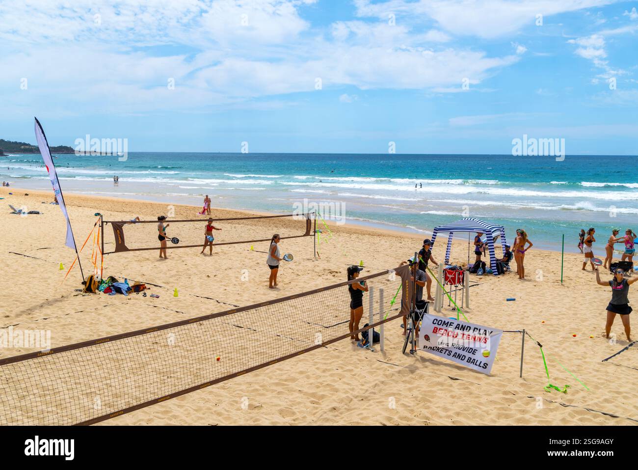 People playing beach tennis on Manly Beach in Sydney, summer sport ...