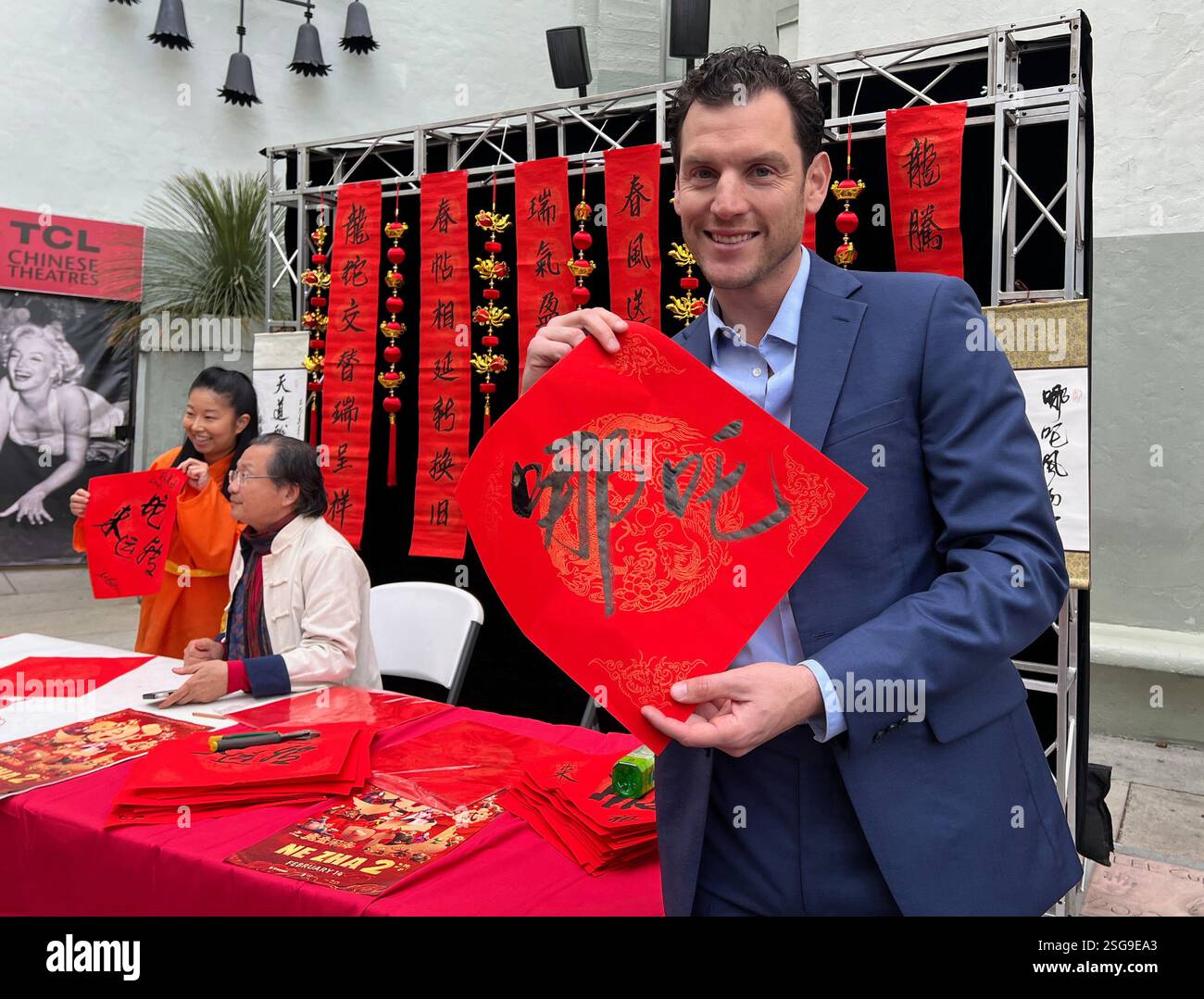 Los Angeles, USA.8th February 2025. Actor Jesse Morales poses with a calligraphy work reading ...