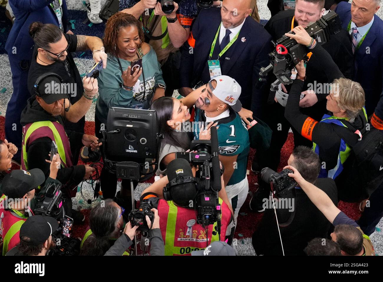 Philadelphia Eagles quarterback Jalen Hurts (1) hugs partner Bryonna ...