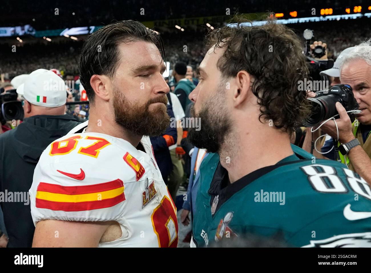 Kansas City Chiefs tight end Travis Kelce, left, greets Philadelphia Eagles tight end Dallas ...