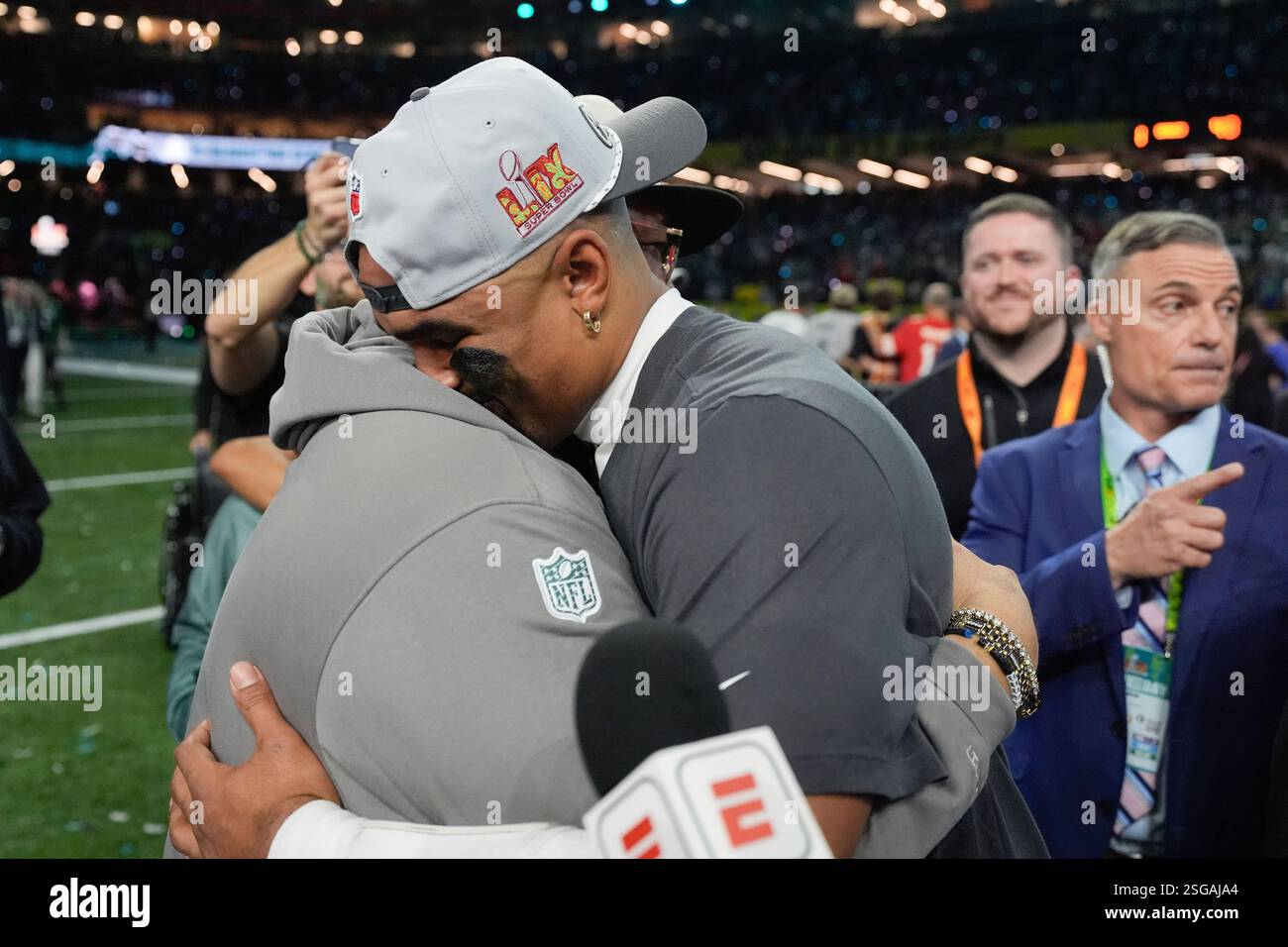 Philadelphia Eagles quarterback Jalen Hurts hugs his father Averion ...