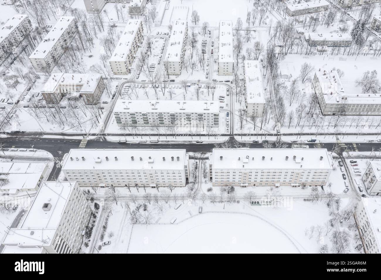 snow-covered roofs of apartment buildings in residential district of ...