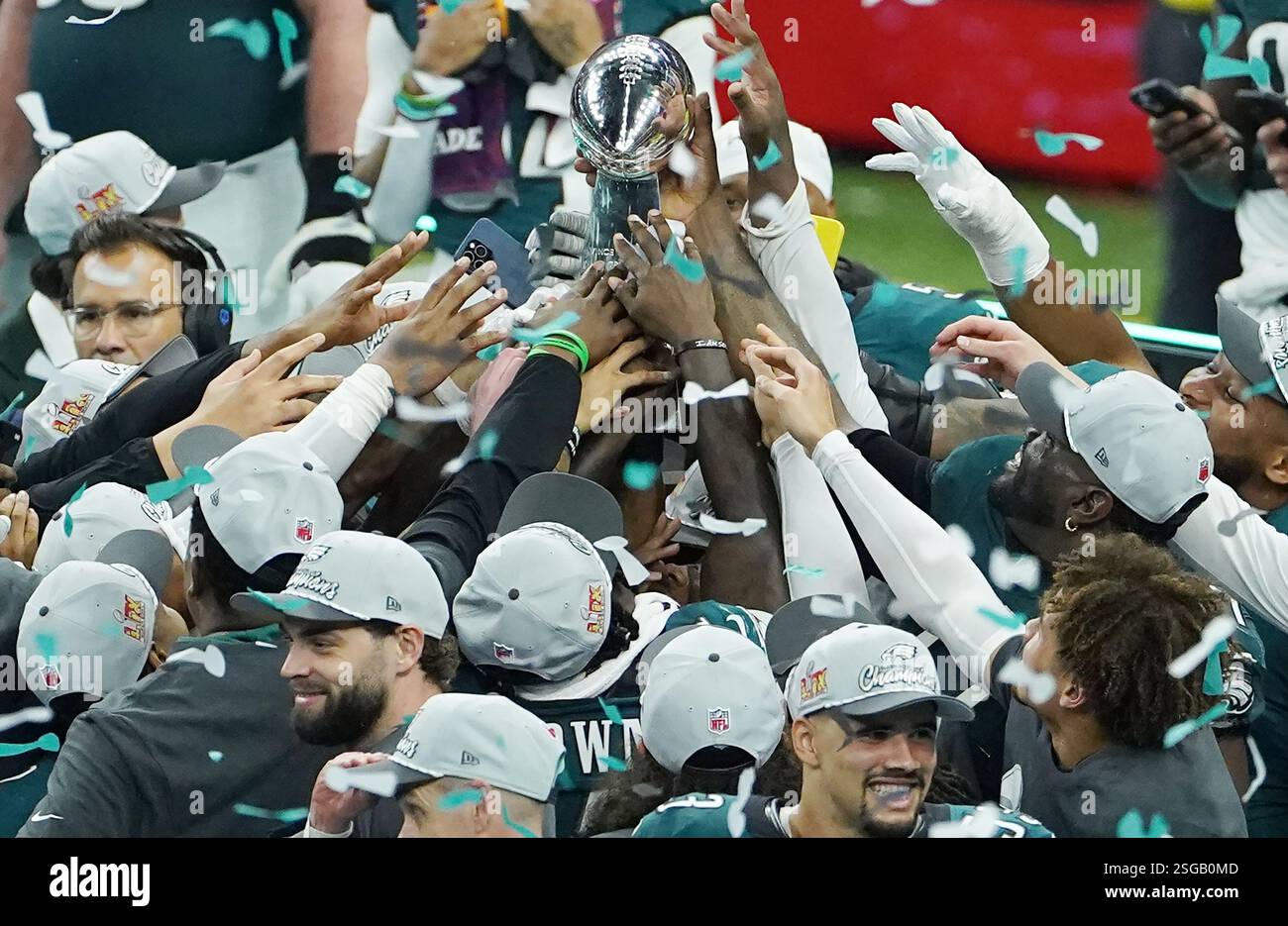 Philadelphia Eagles players hold the Vince Lombardy Trophy after ...