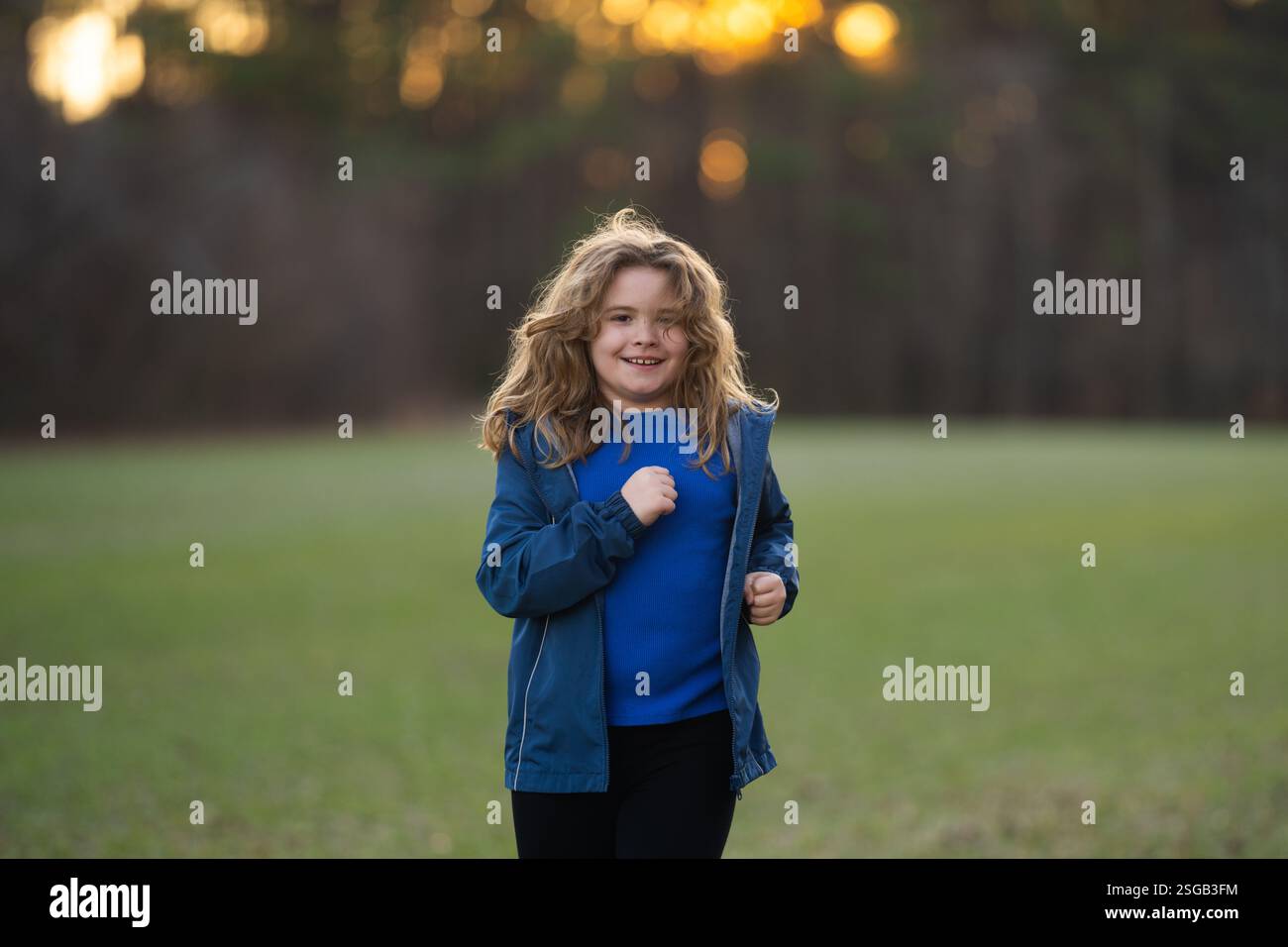Kid boy in motion, full of energy. Running kids playing in the sunshine ...